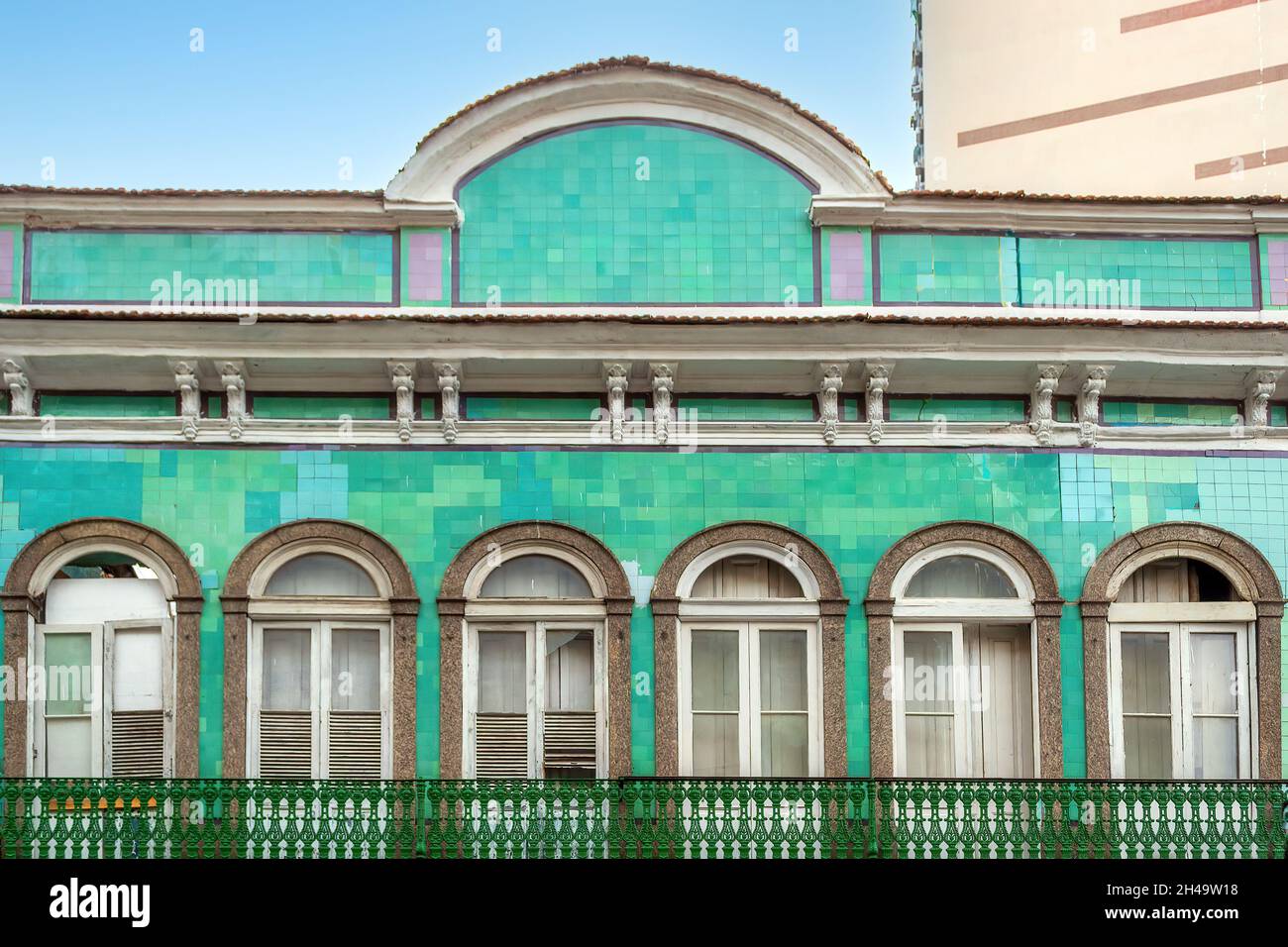 Colonial style architecture in a building covered in tiles. It is ...