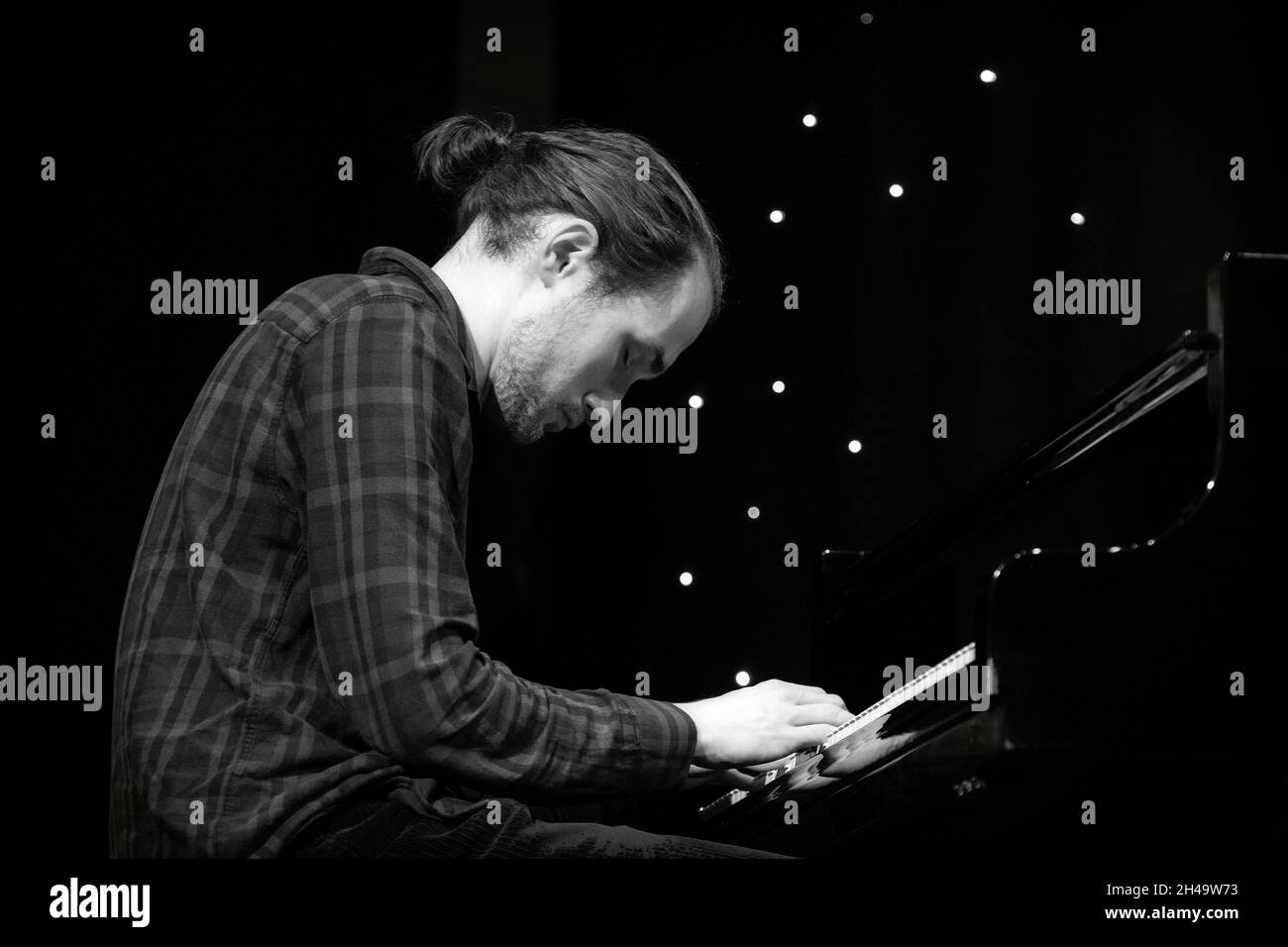 Fergus McCreadie playing piano with The Fergus McCreadie Trio ...