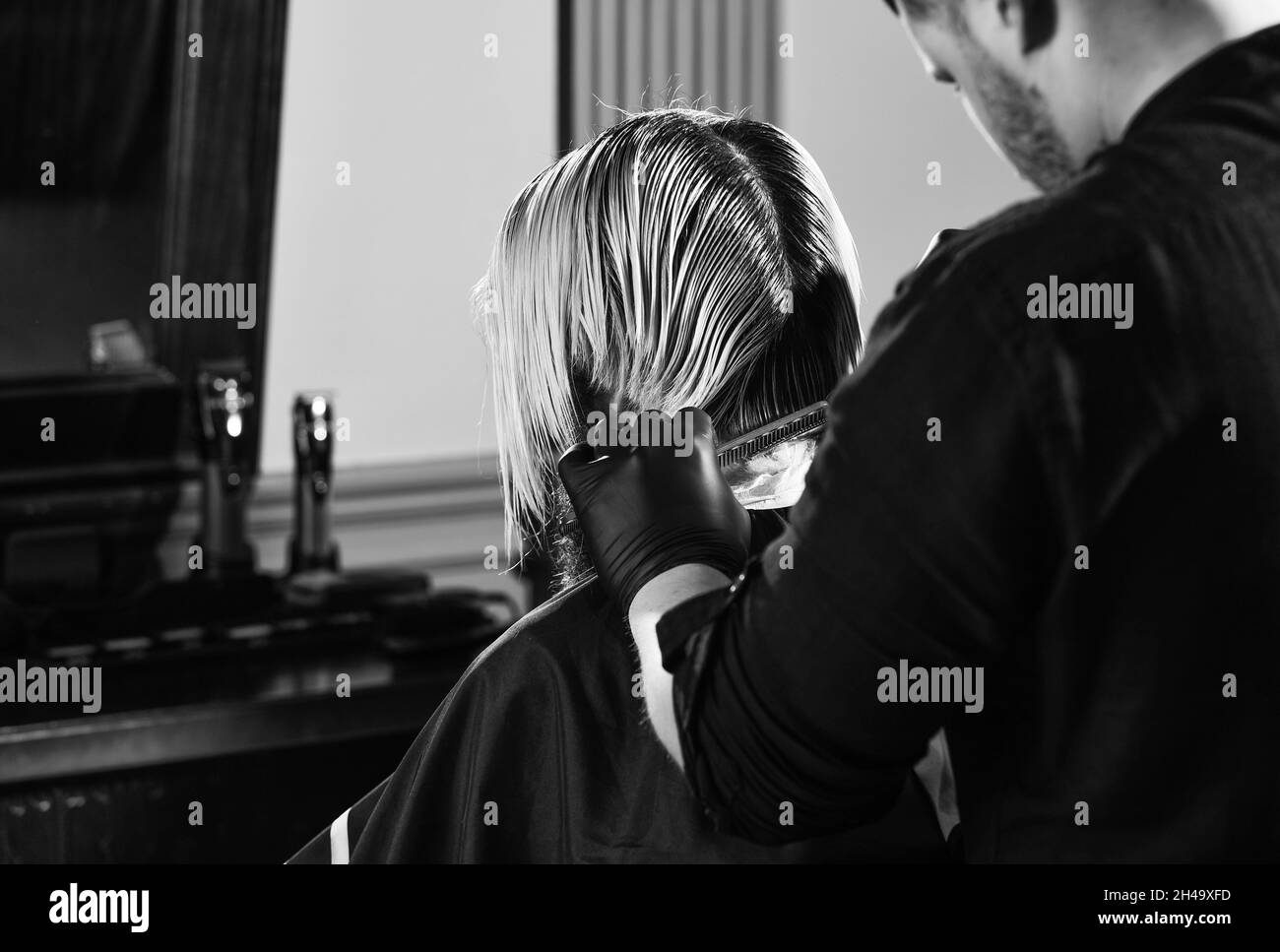 Hairdressing at its finest. male hairdresser salon. barber professional ...