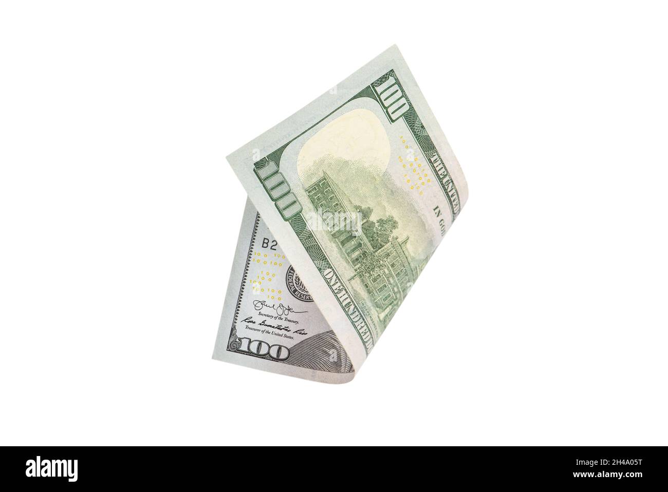 Isolate on white hundred dollar bills. American money folded in half ...