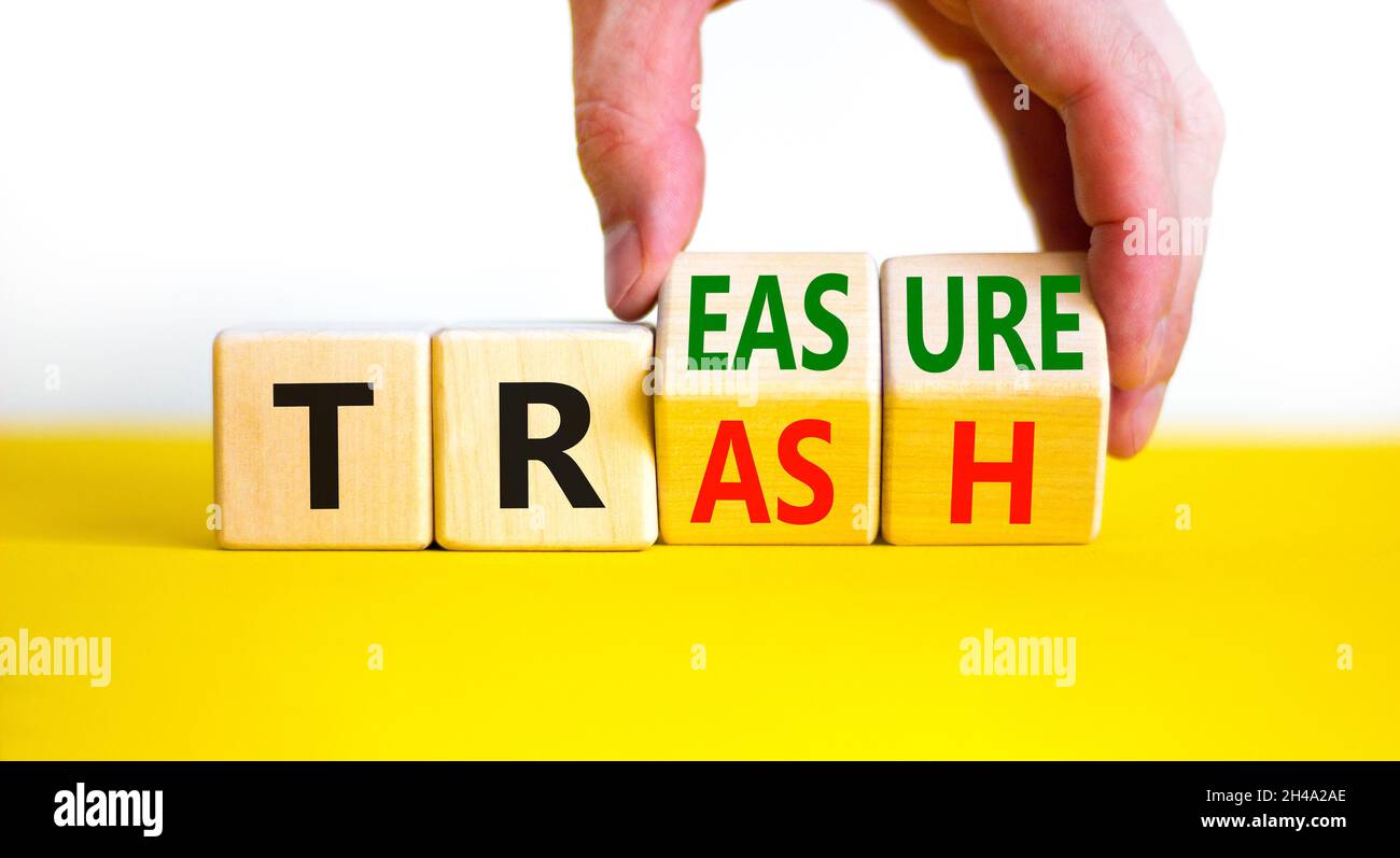 Trash to treasure symbol. Businessman turns cubes and changes the word ...