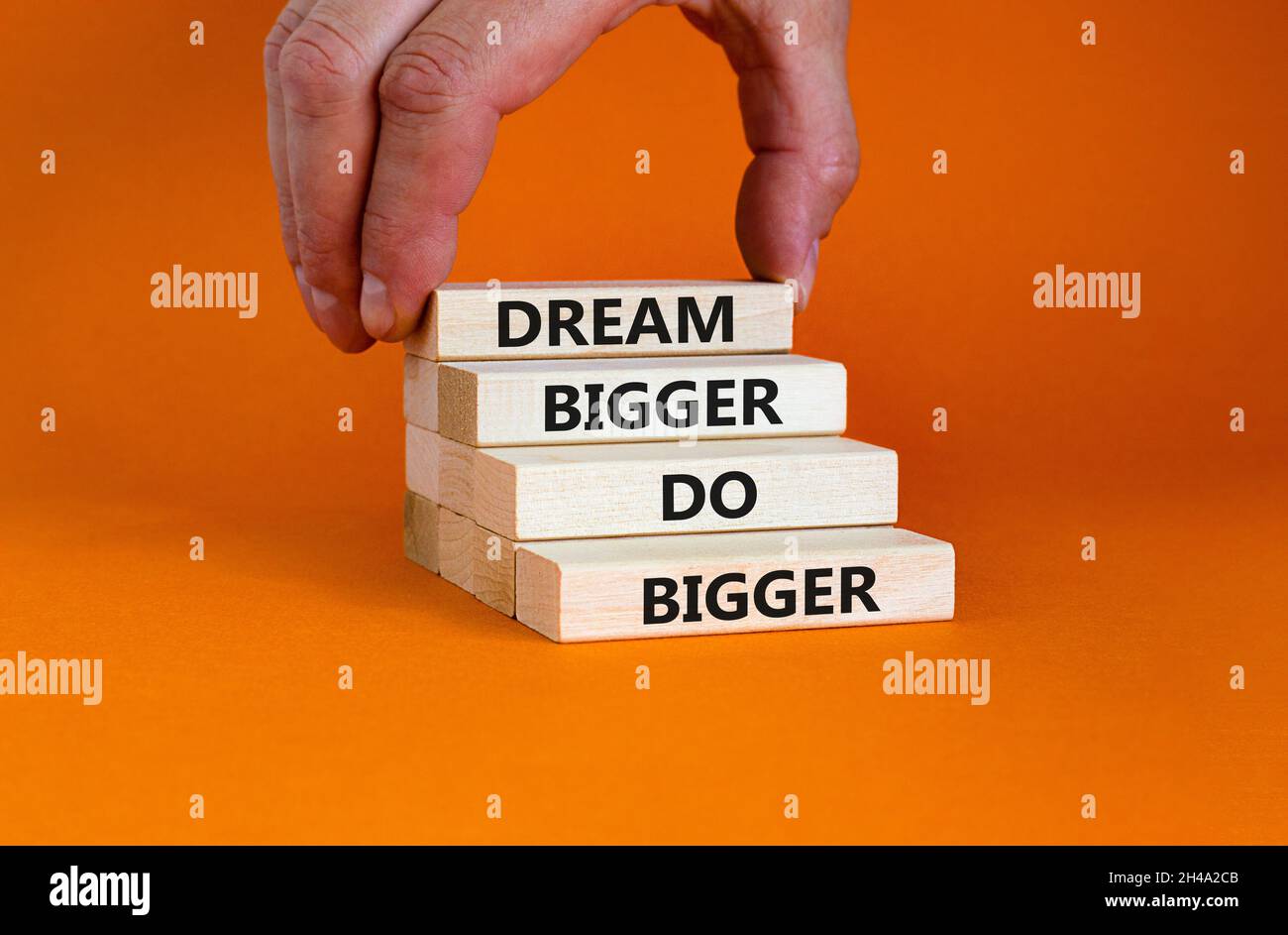 Dream and do bigger symbol. Concept words 'Dream bigger do bigger' on ...