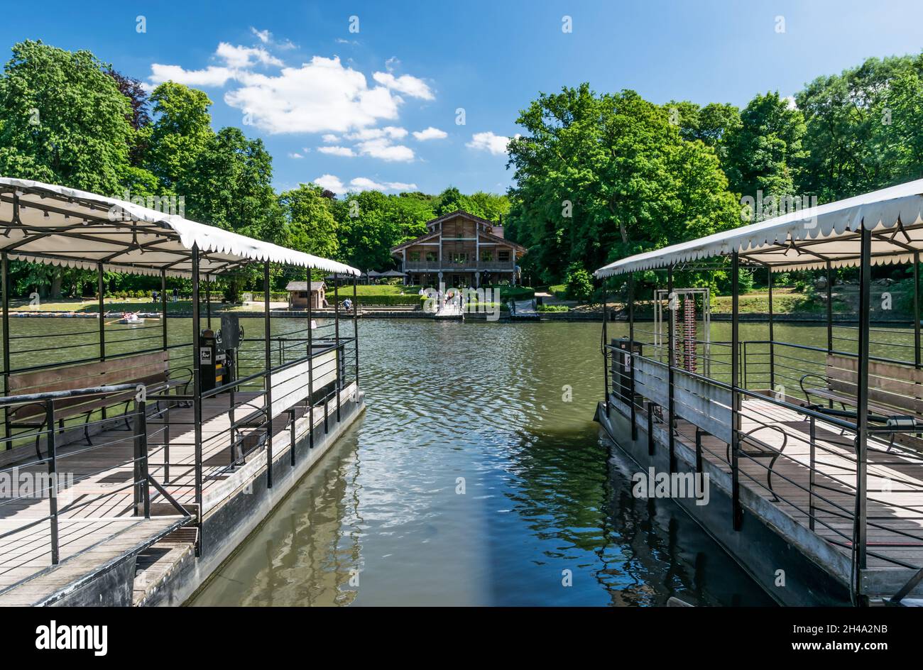 Two pulled vessels at the water pond of the La Cambre park, Ixelles ...