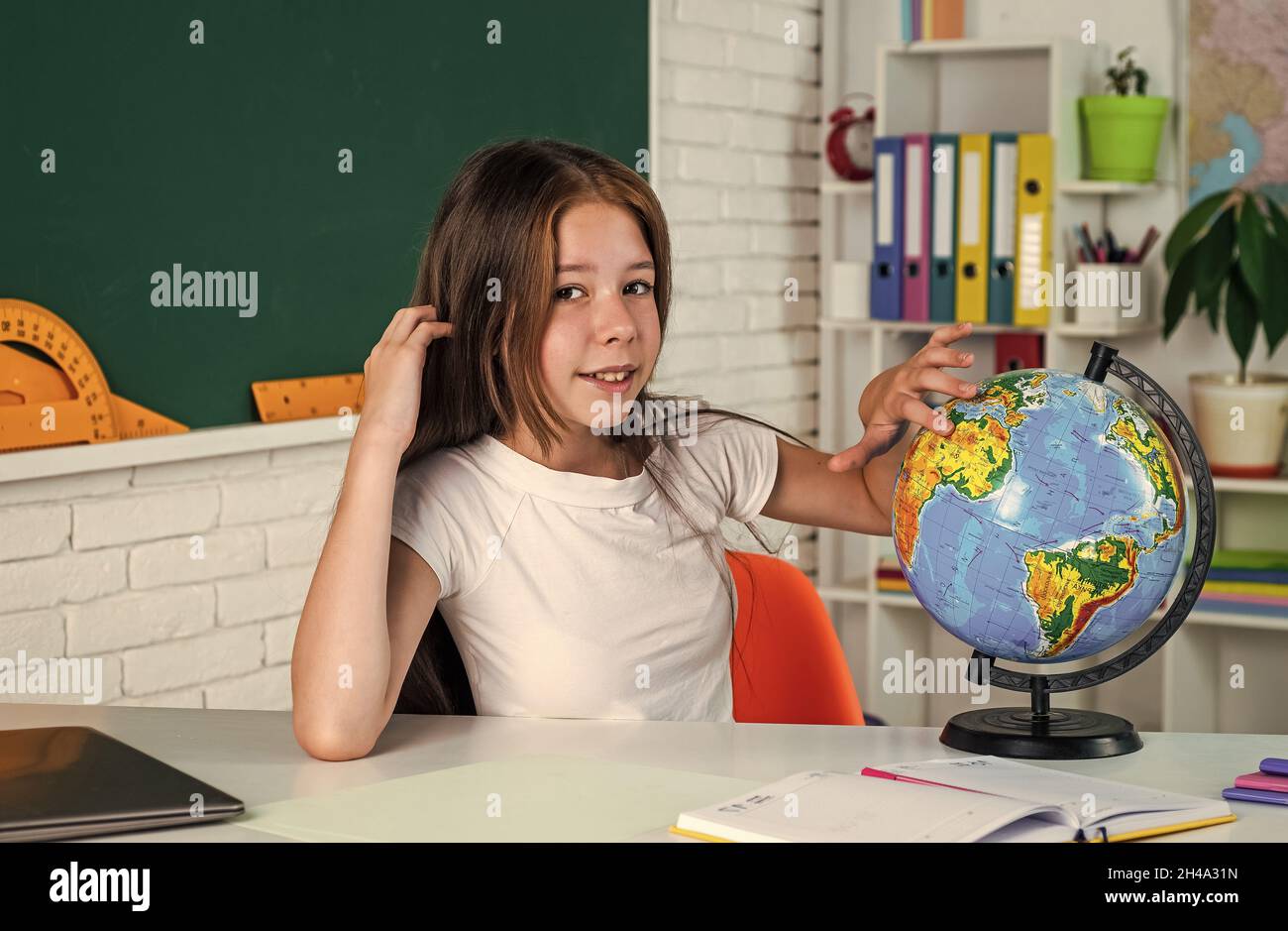 child look at globe. geography. back to school. formal education in ...