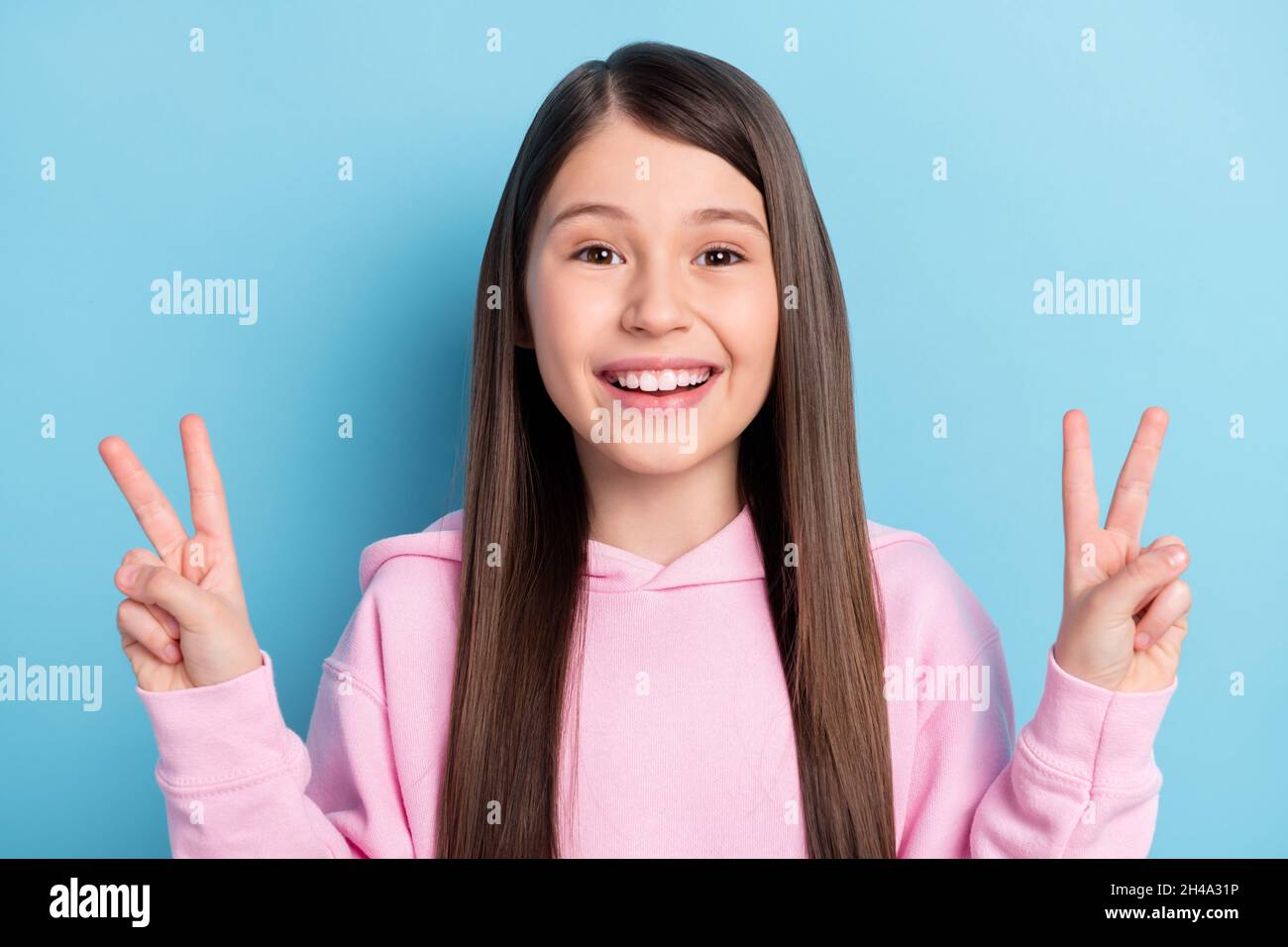 Photo of young preteen girl happy positive smile show peace cool v-sign ...