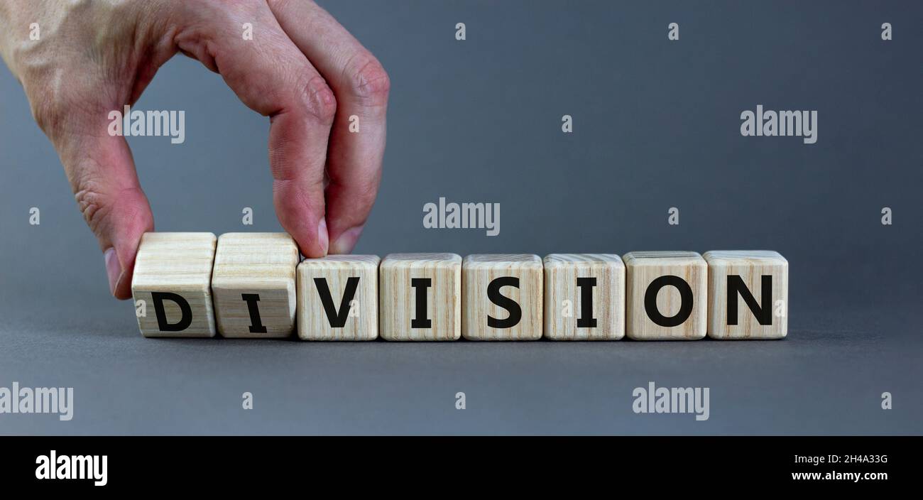 Division or vision symbol. Businessman turns wooden cubes and changes ...