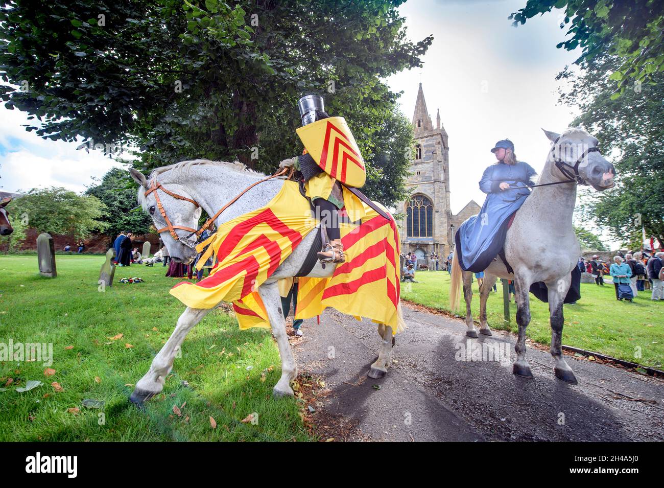 Royalist knights join a procession from St Lawrence's churchyard before ...