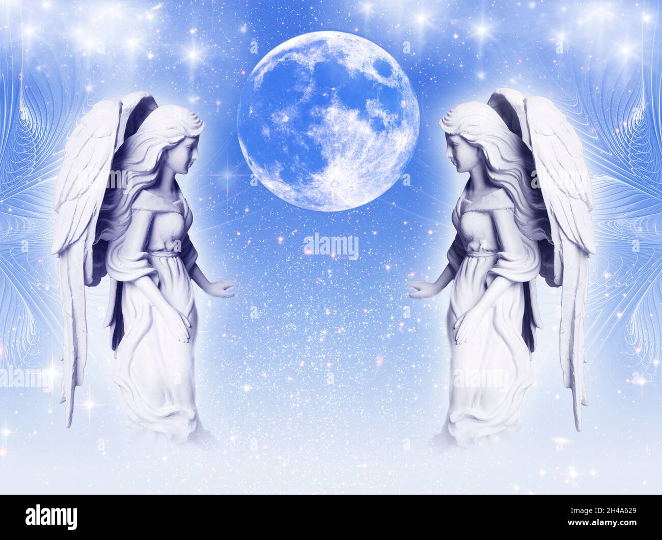 two angels archangels with divine rays of light Stock Photo - Alamy