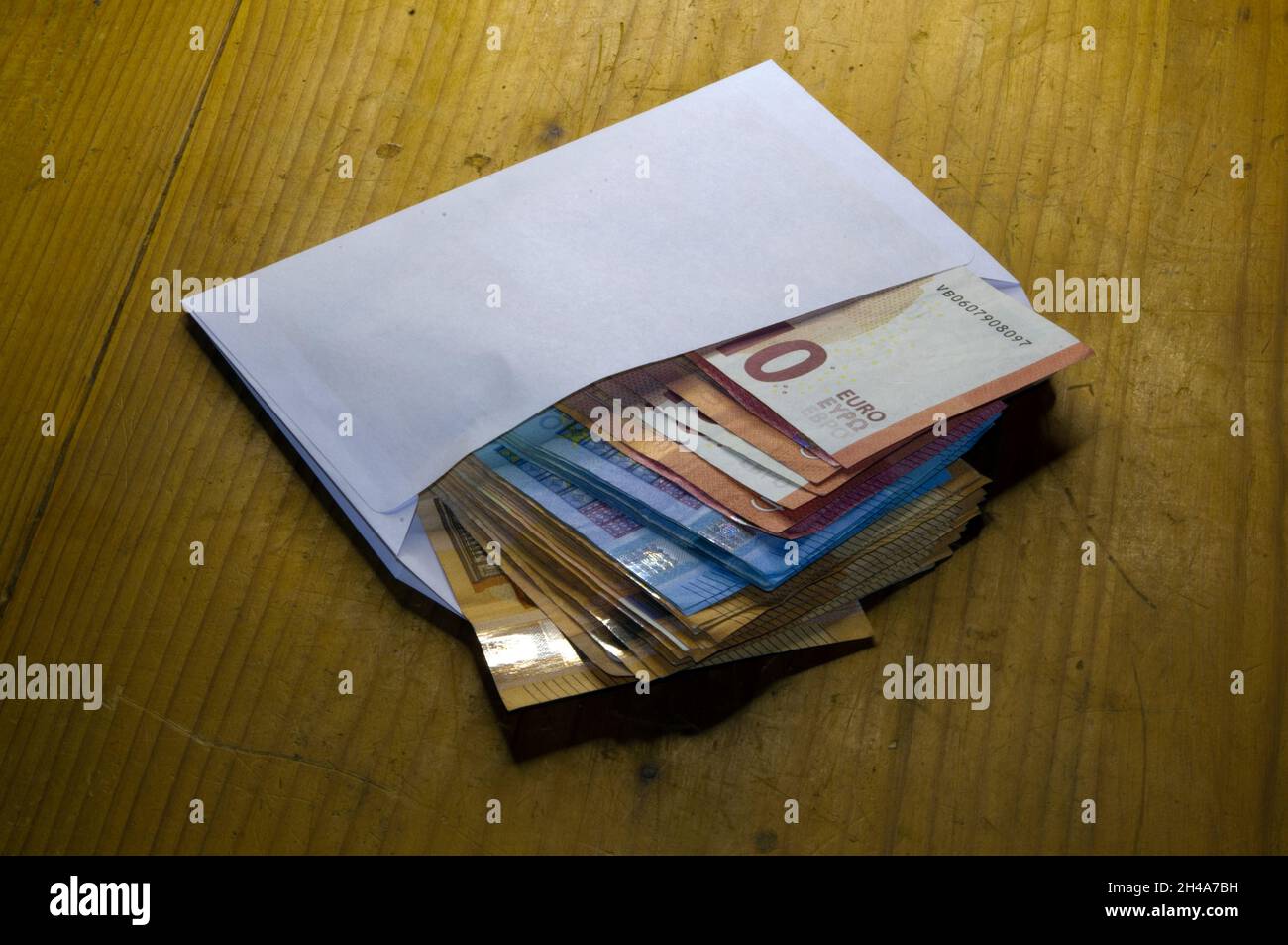 Money bundles, banknotes in a white envelope, isolated Stock Photo - Alamy