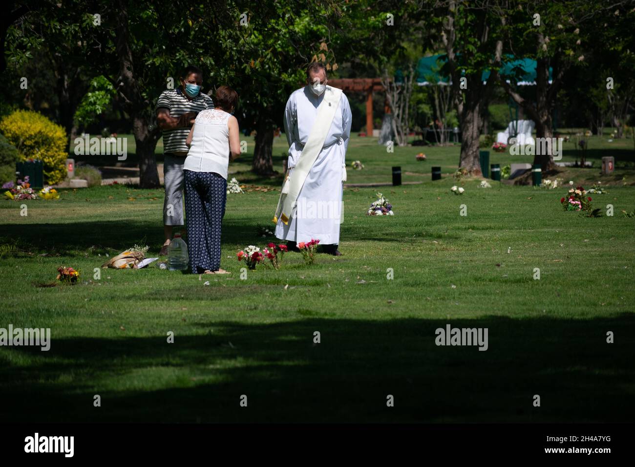 Santiago, Metropolitana, Chile. 1st Nov, 2021. A priest offers prayers ...