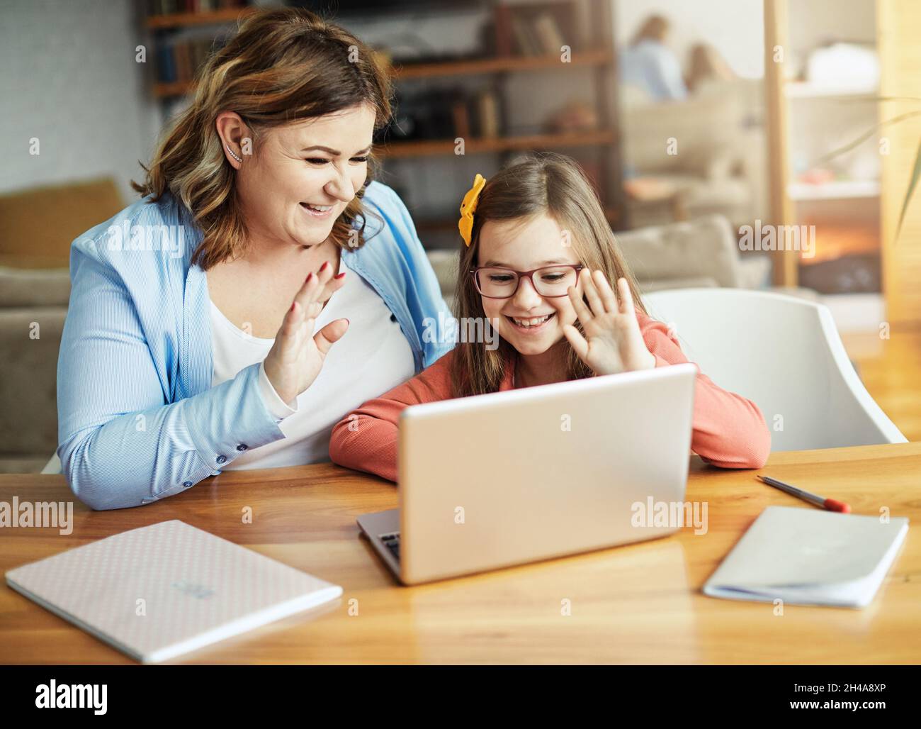 laptop computer video call chatting mother children daughter classroom ...
