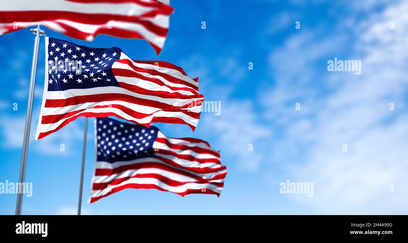 Three flags of the United States of America waving in the wind. Clear ...