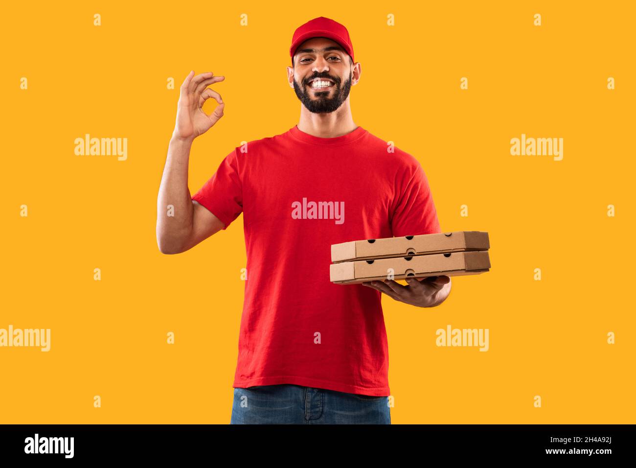 Pizza Delivery Concept. Middle Eastern Courier Guy Holding Pizza Boxes ...