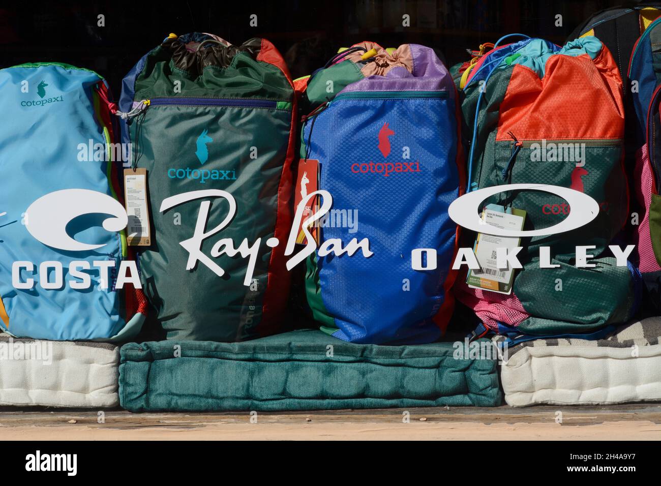 Camping gear on display in a window of a outdoor recreation equipment ...