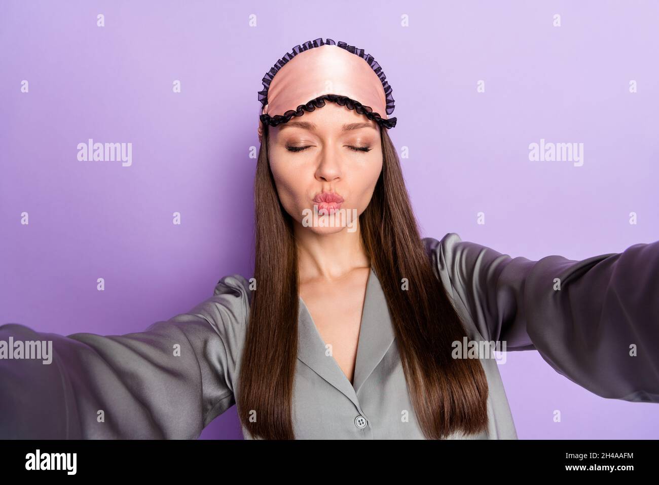 Self Portrait Of Attractive Amorous Girl Wearing Pajama Sending Air