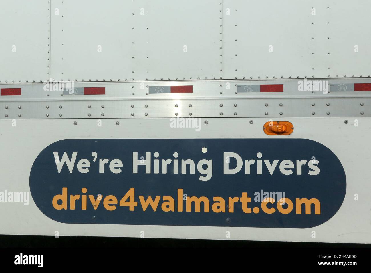 The Walmart truck fleet has WeÕre Hiring Drivers signage on the side of ...