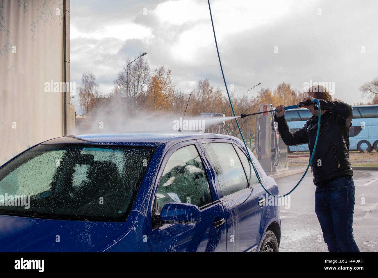 Handsome man washing car hi-res stock photography and images - Alamy