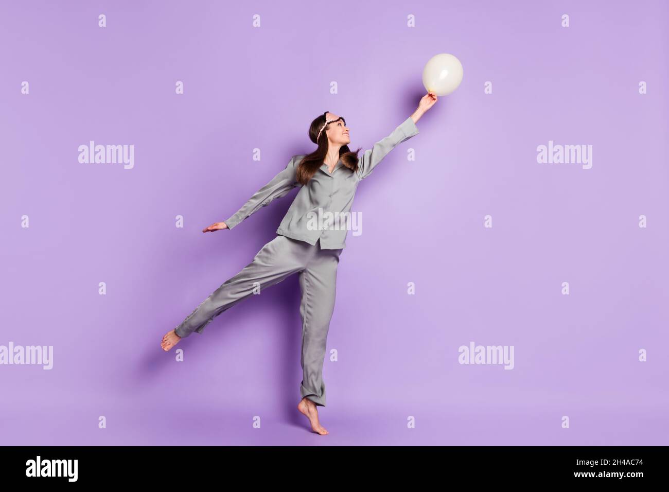 Full length body size photo of girl in grey sleep wear mask jumping ...