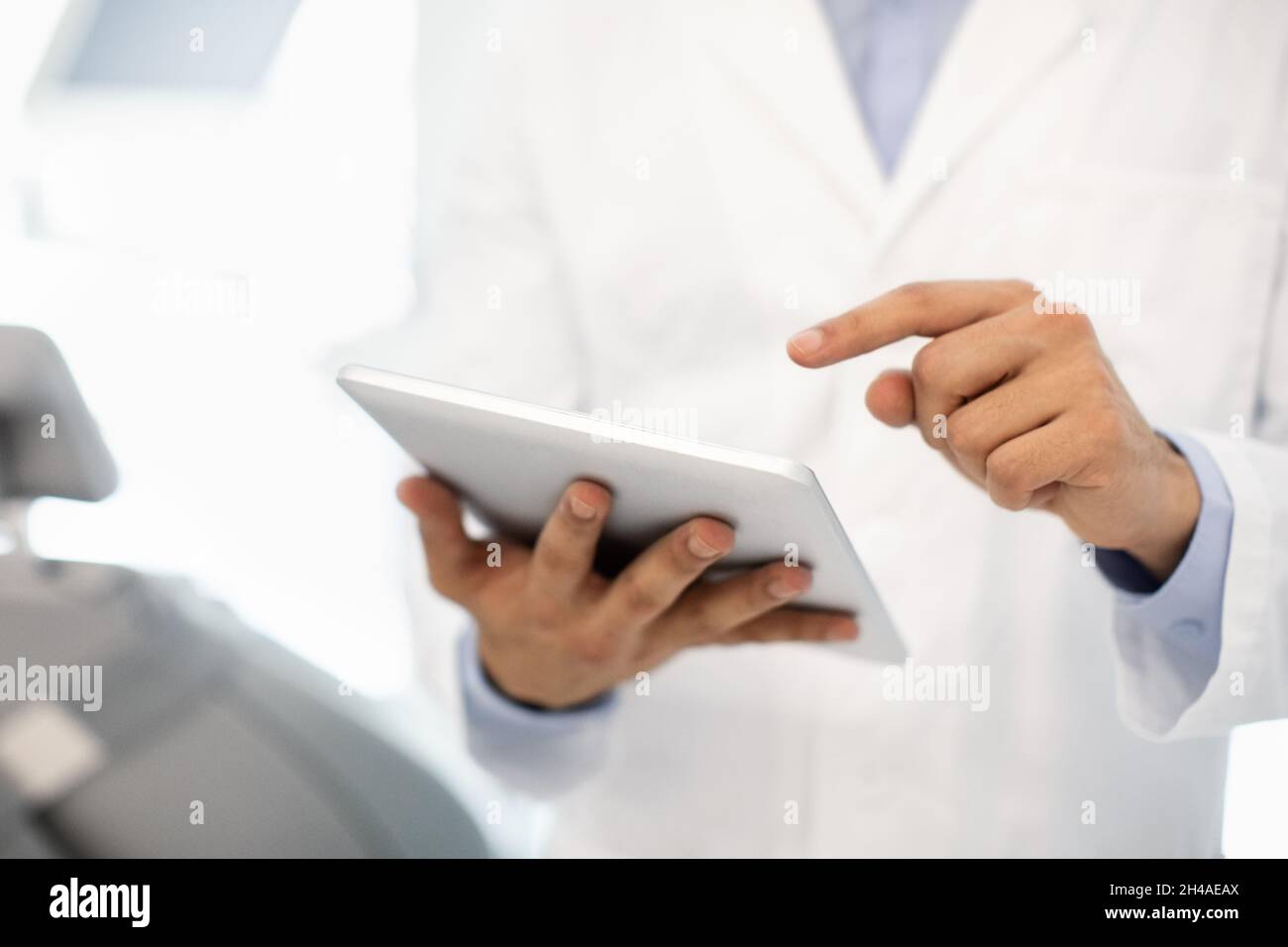 Modern Technologies And Dentistry. Closeup Of Male Dentist Using ...