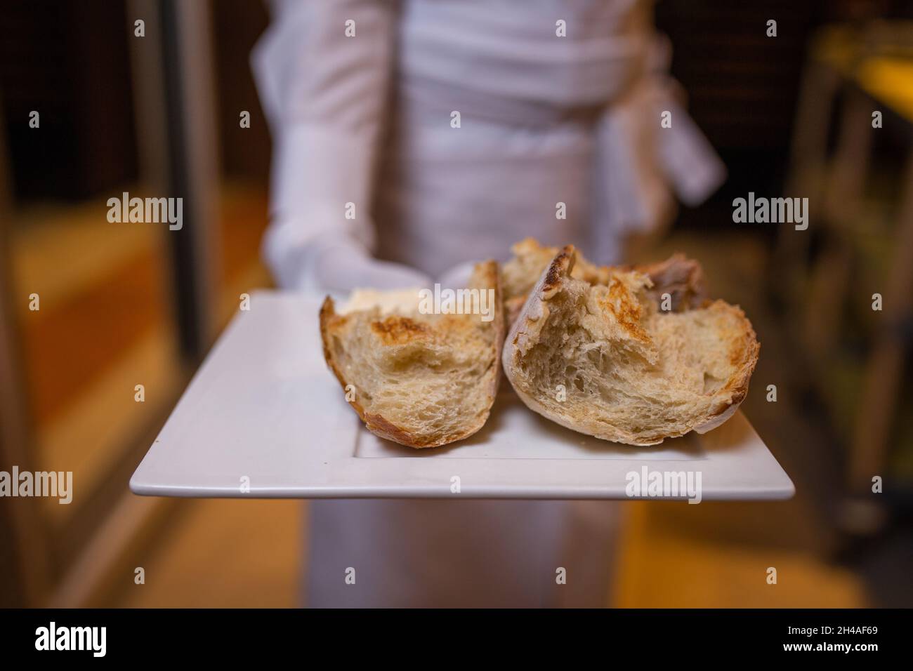 Female hand holds plate on hi-res stock photography and images - Alamy