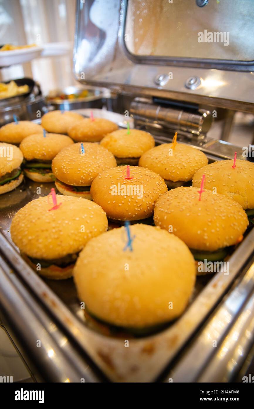 lots of burgers on the buffet table in the hotel restaurant Stock Photo ...