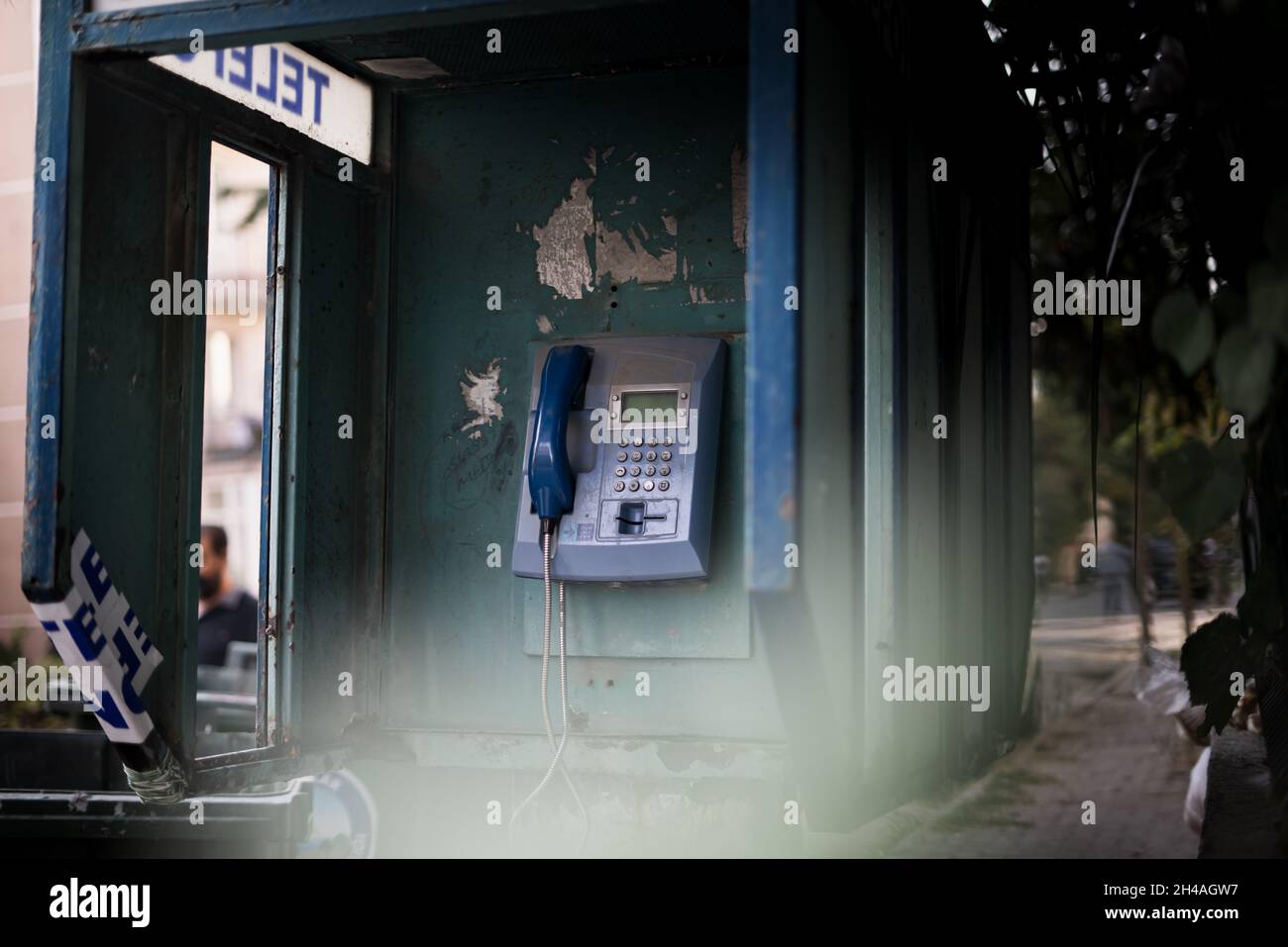Old blue telephone booth with numbers with cinematic light in Istanbul ...