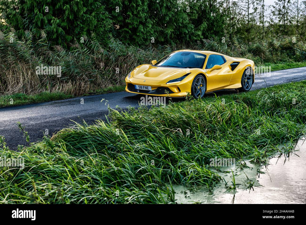 Yellow Ferrari F8 Spider sportswear photographed on the Gwent Levels ...