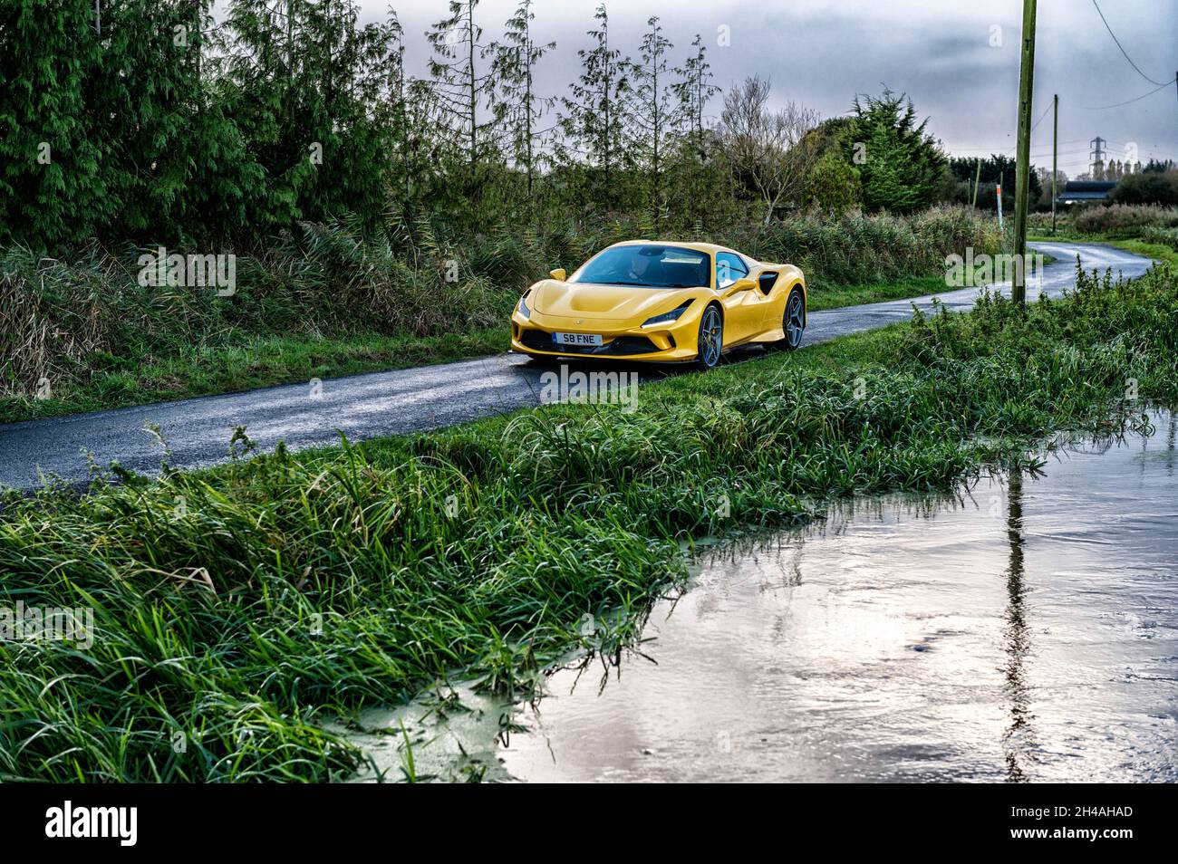 Yellow Ferrari F8 Spider sportswear photographed on the Gwent Levels ...