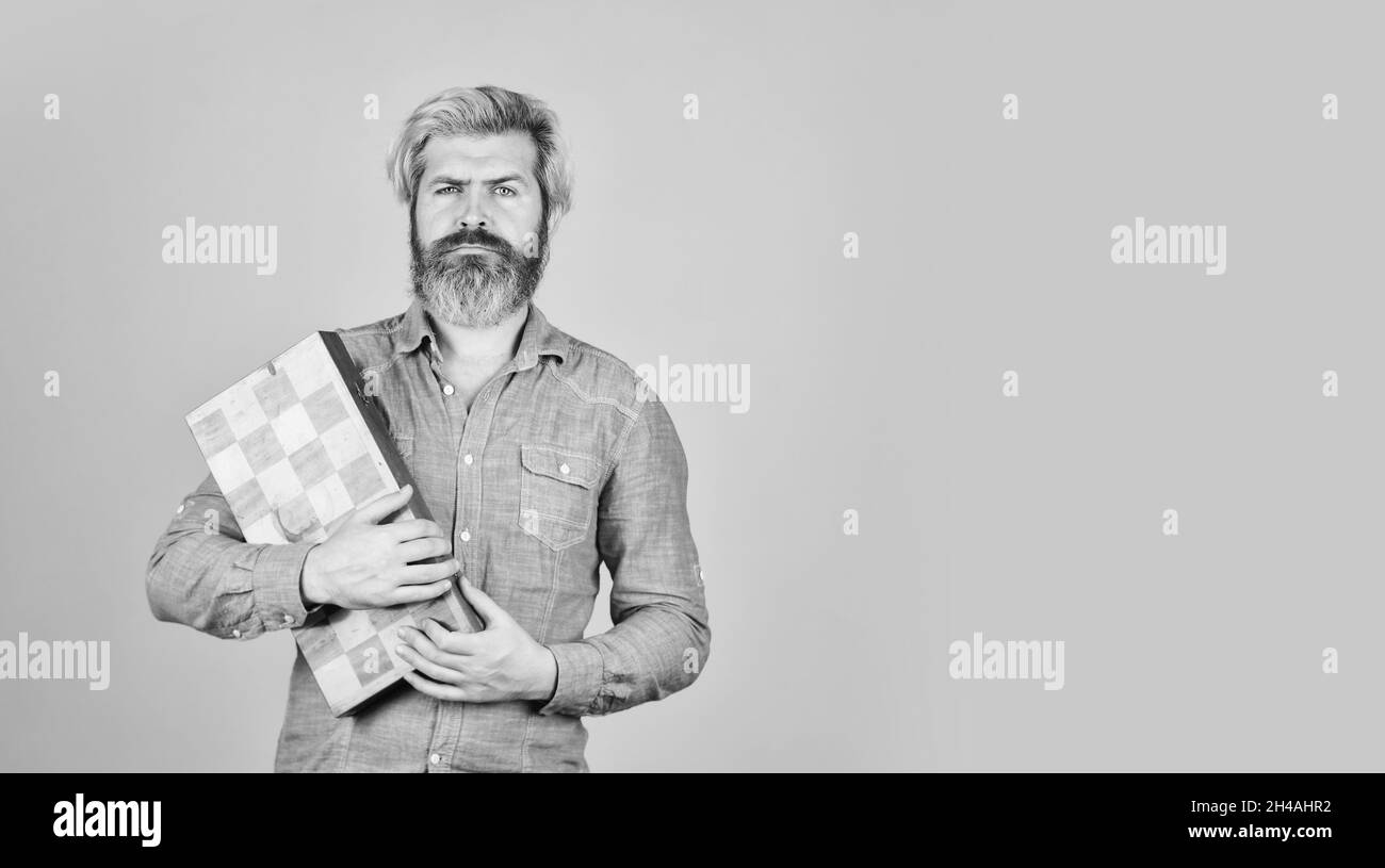 bearded man hold chess board. intelligence quotient. human brain ...
