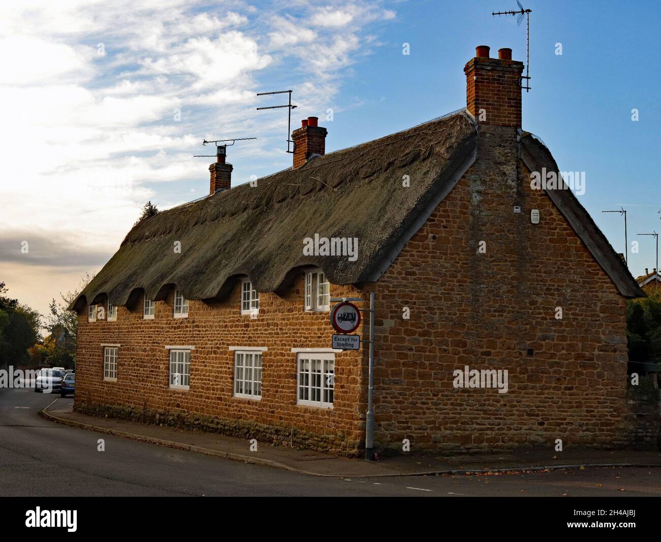 Thatched cottages on the High Street in Ecton, the Northamptonshire ...