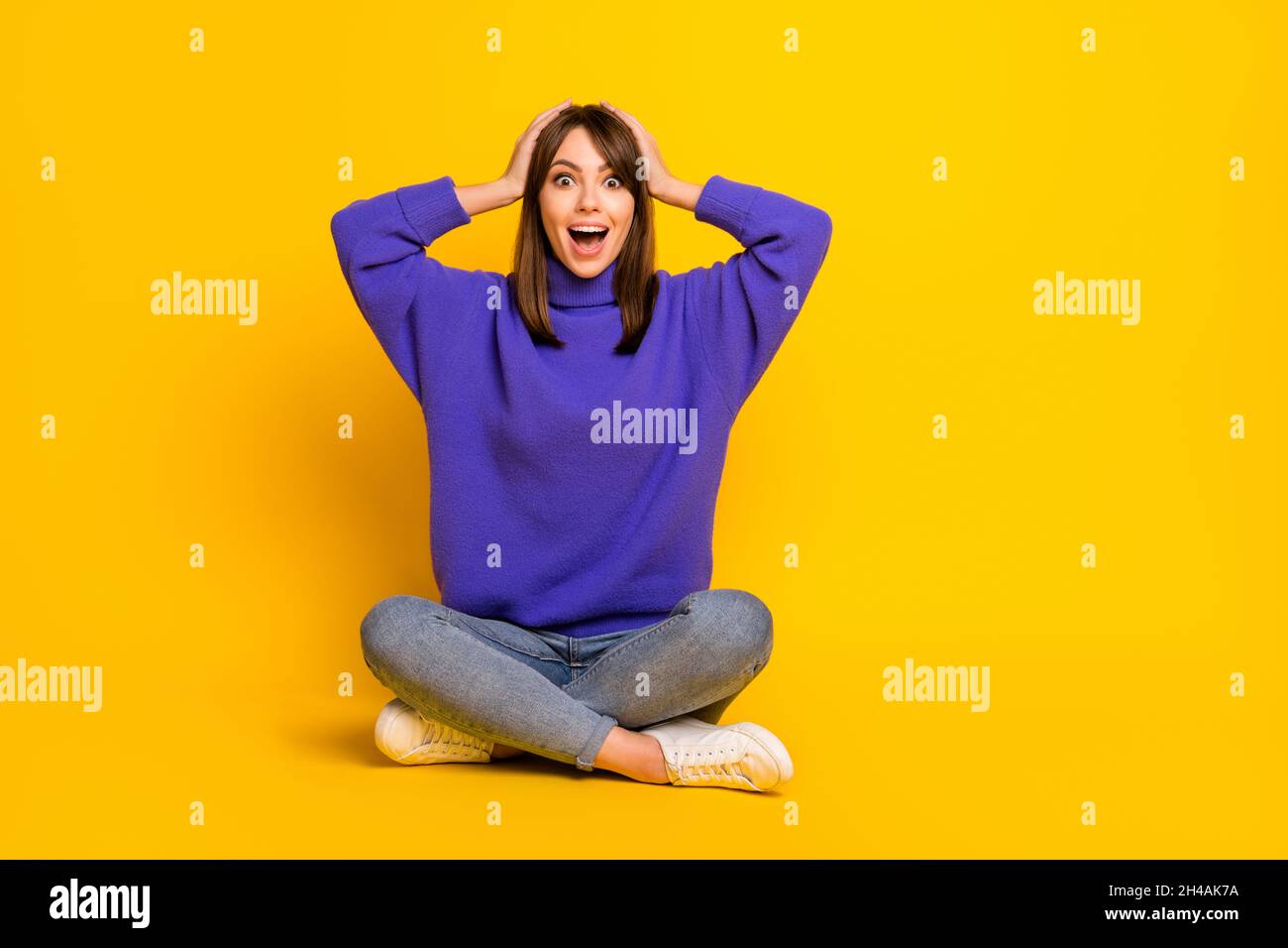 Portrait of attractive cheerful amazed girl sitting in lotus pose great ...
