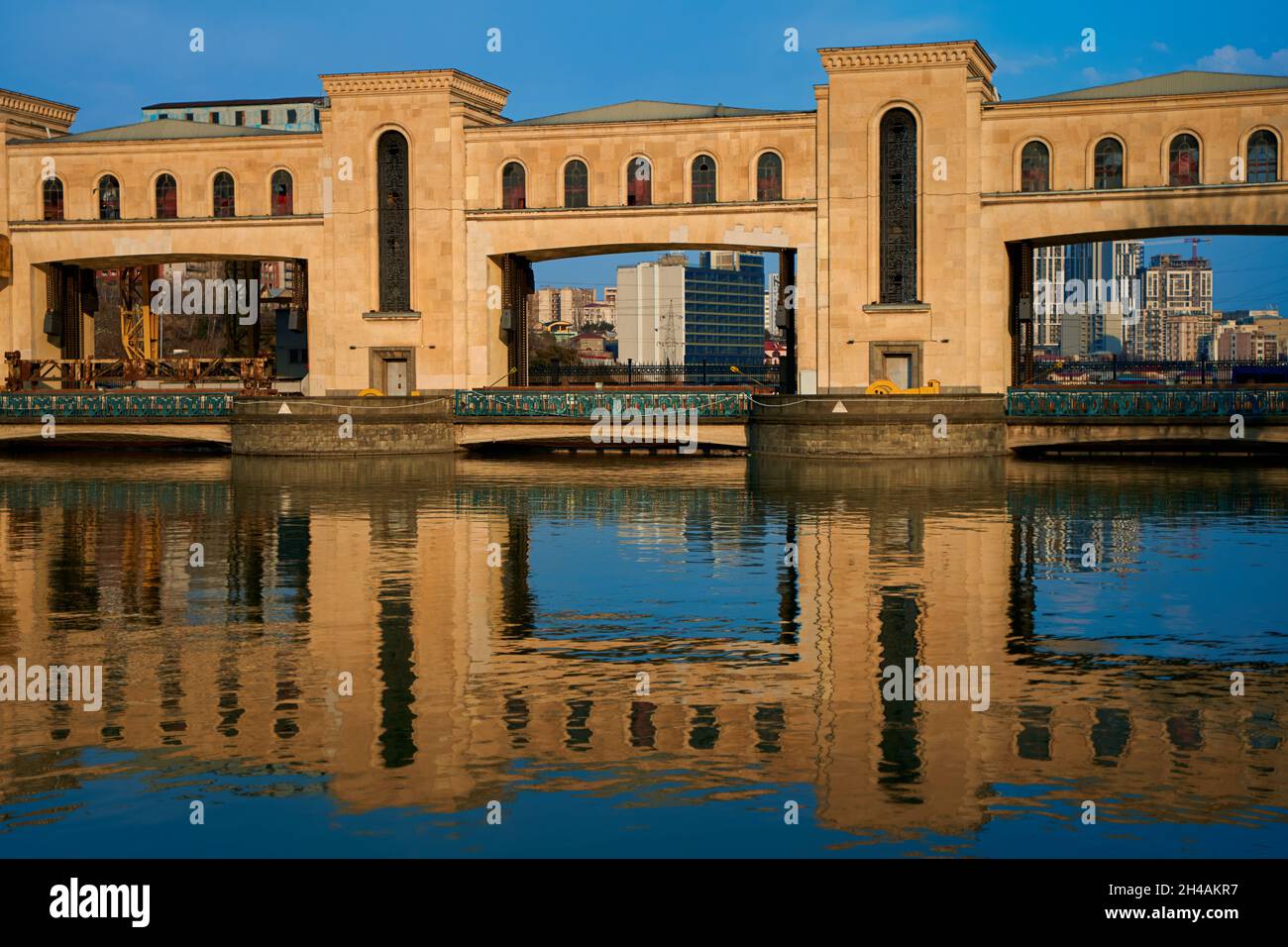 Bridge with sluice gate on the river. Old industry architecture Stock ...