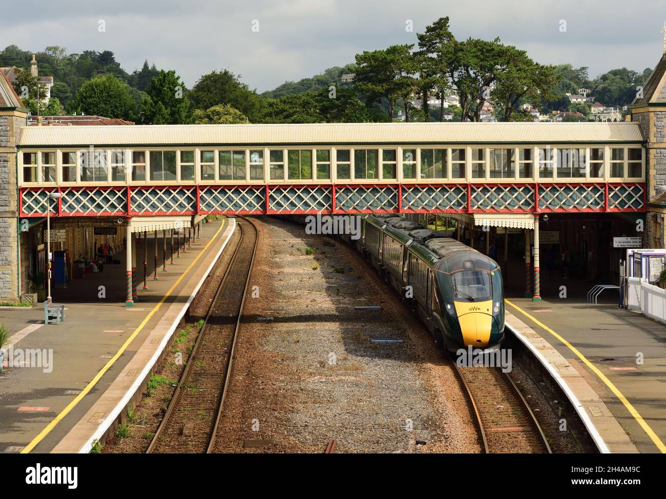 Torquay railway station and attractive footbridge, as an Intercity ...
