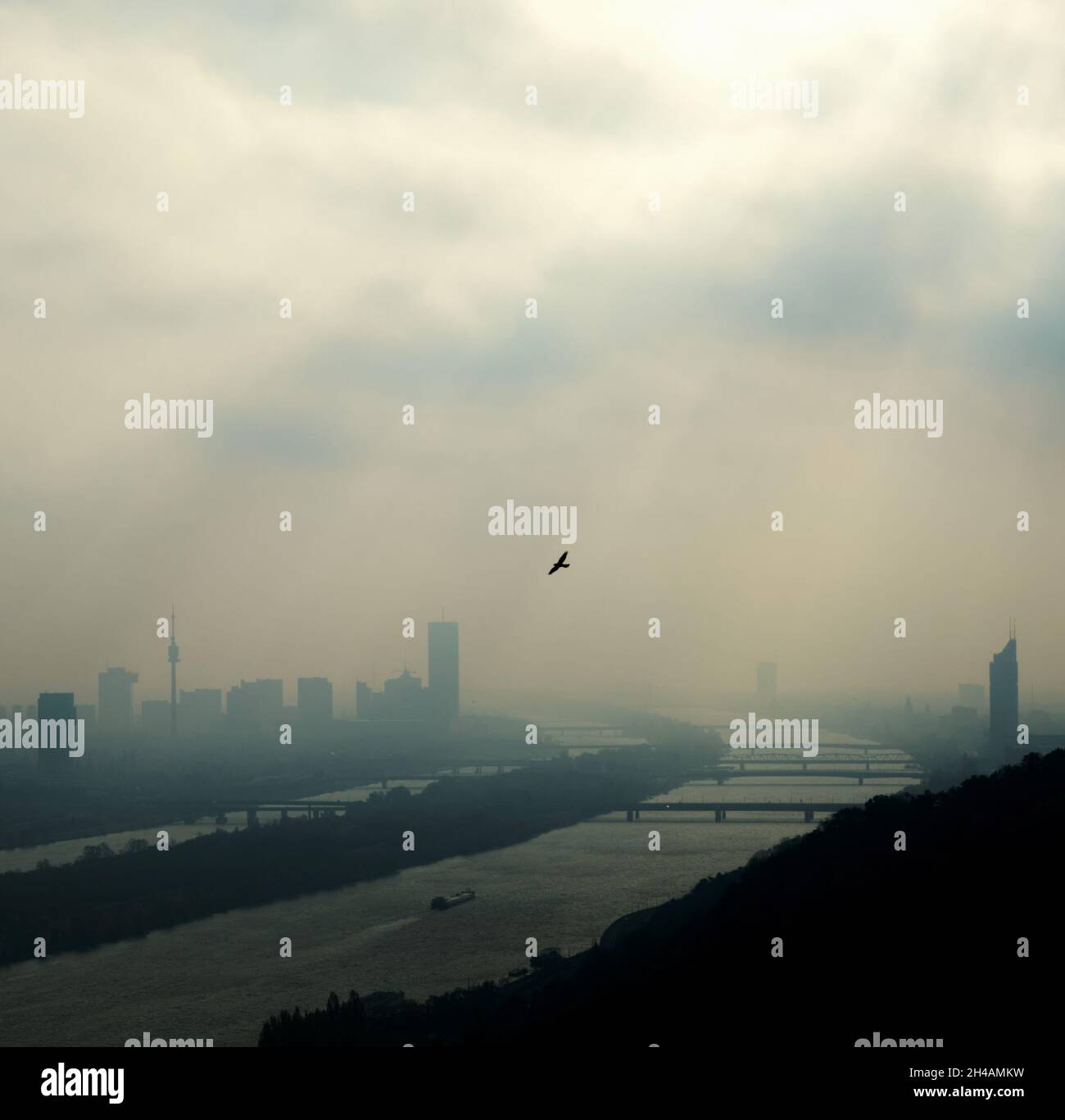 Moddy misty sunrise with god rays over the city of Vienna in autumn ...