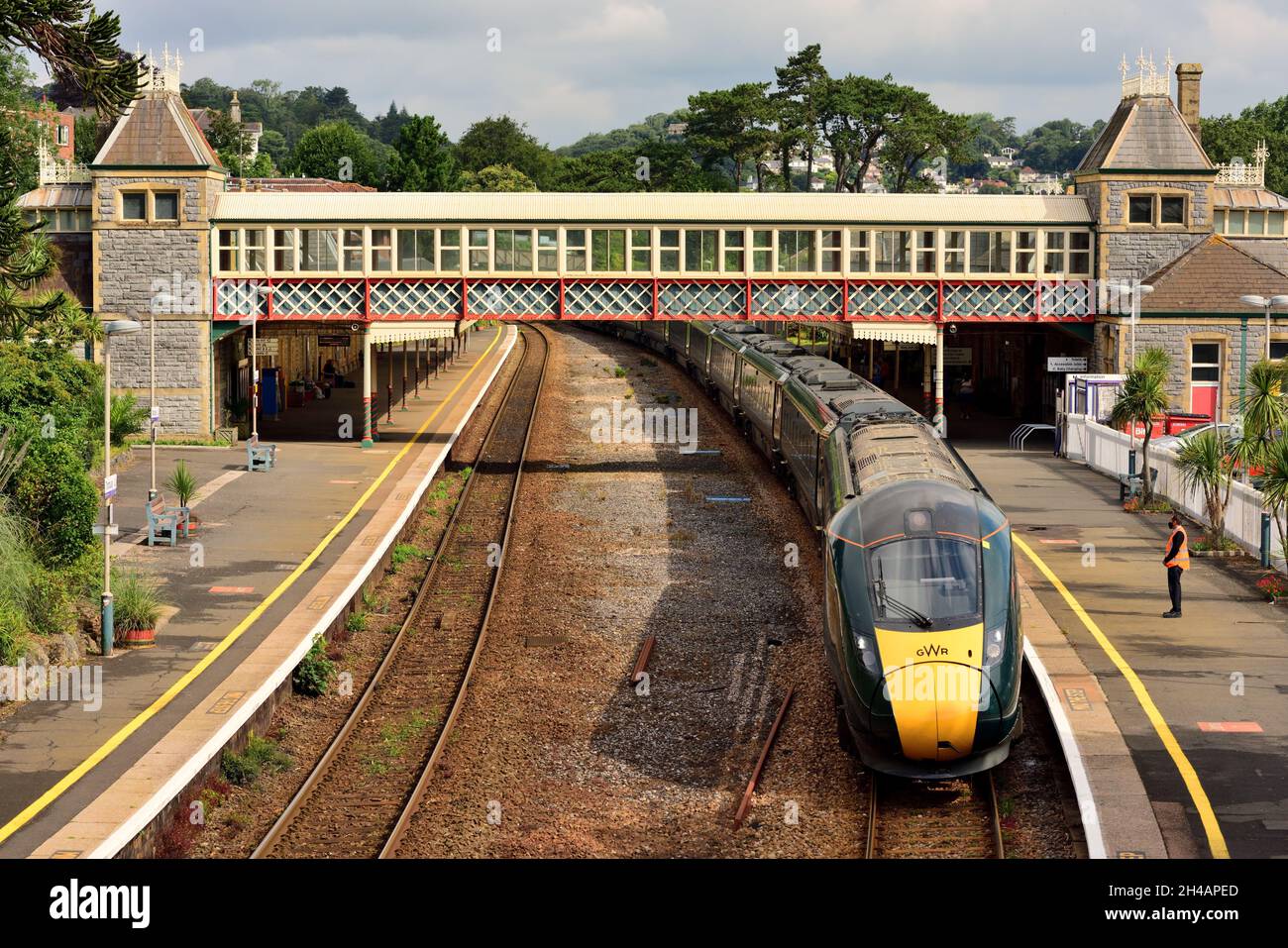 Torquay railway station and attractive footbridge, as an Intercity ...