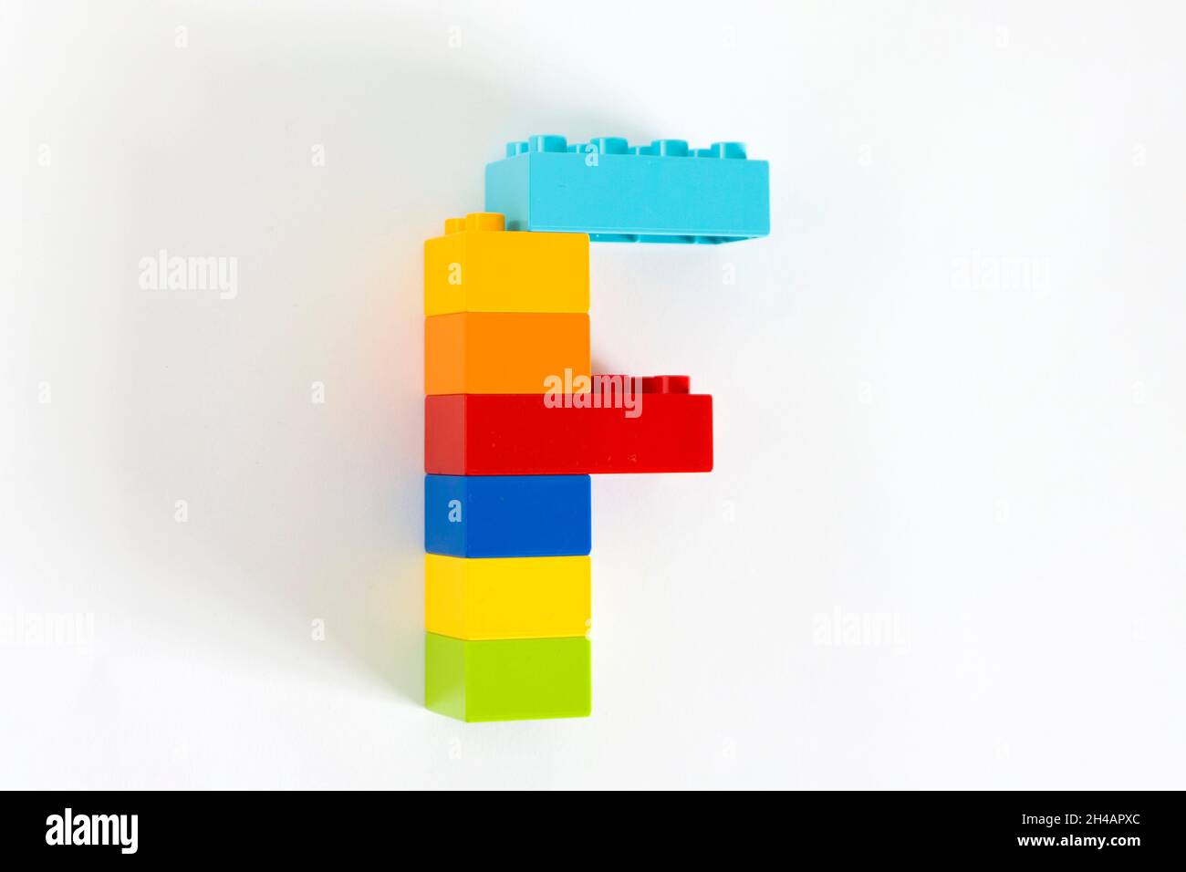 Colorful toy brick letter F isolated on the white background Stock ...