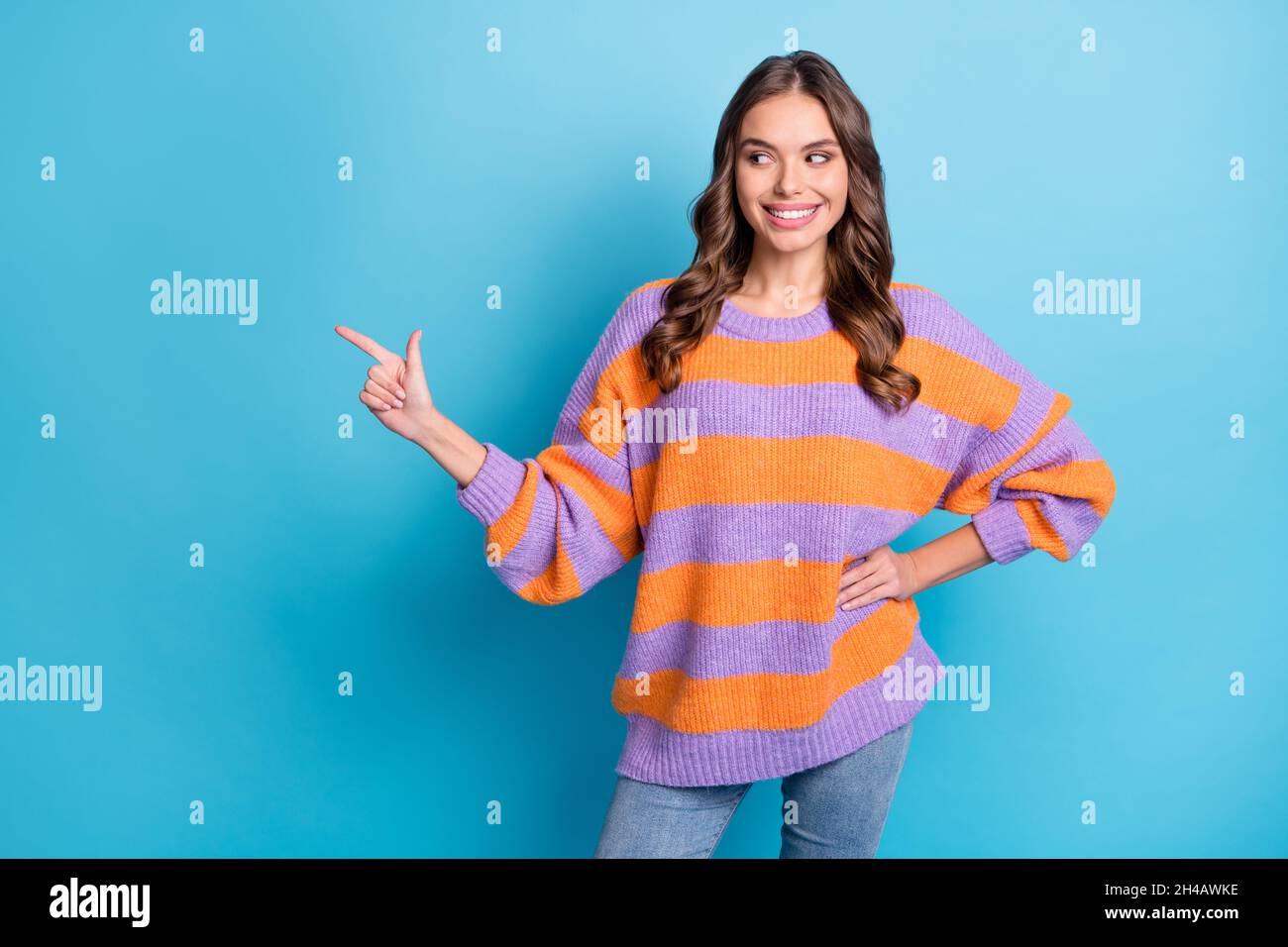 Photo of charming happy young woman look point finger empty space smile ...