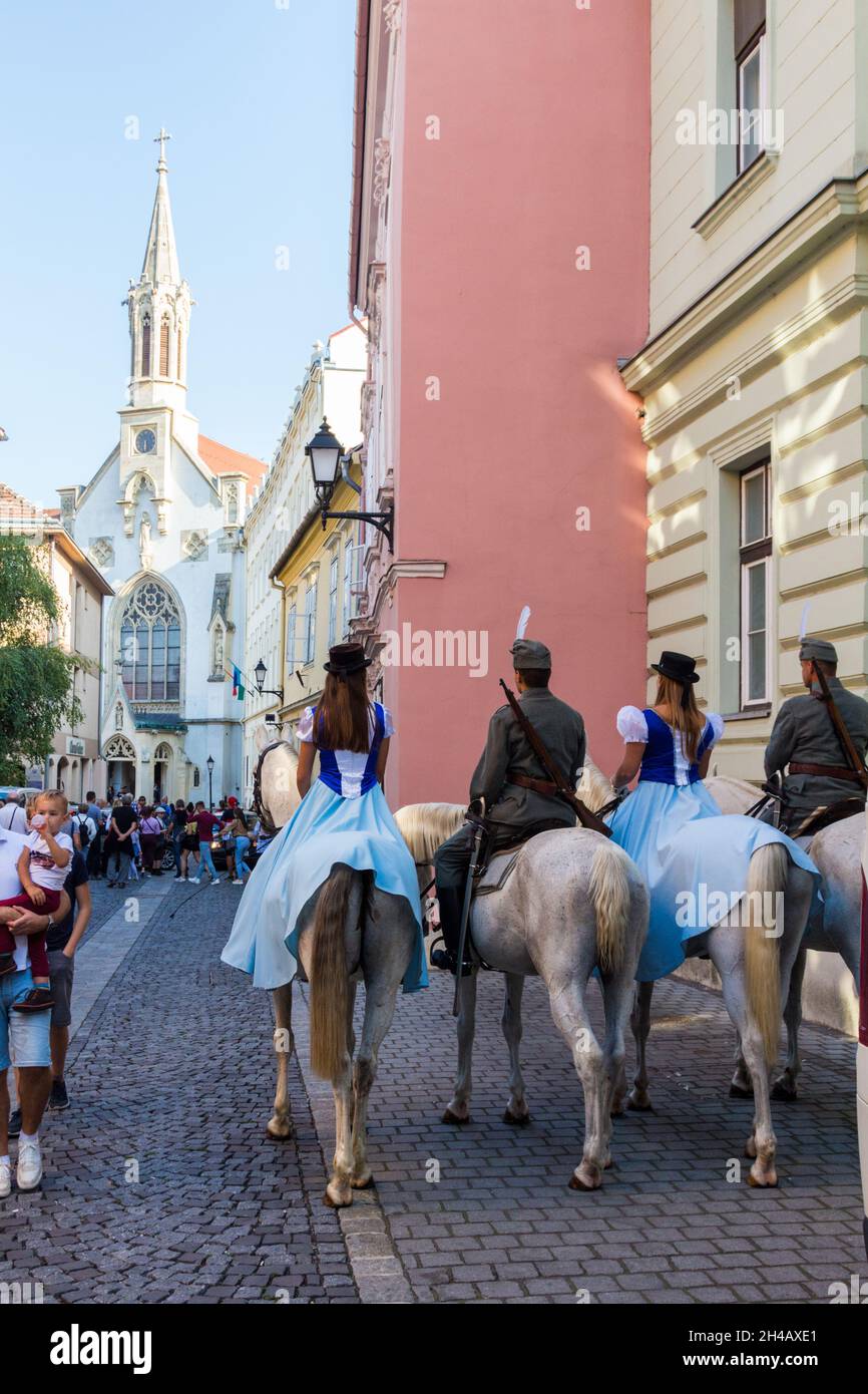 Soldiers and women riding horses in the street, Kult100 event during ...