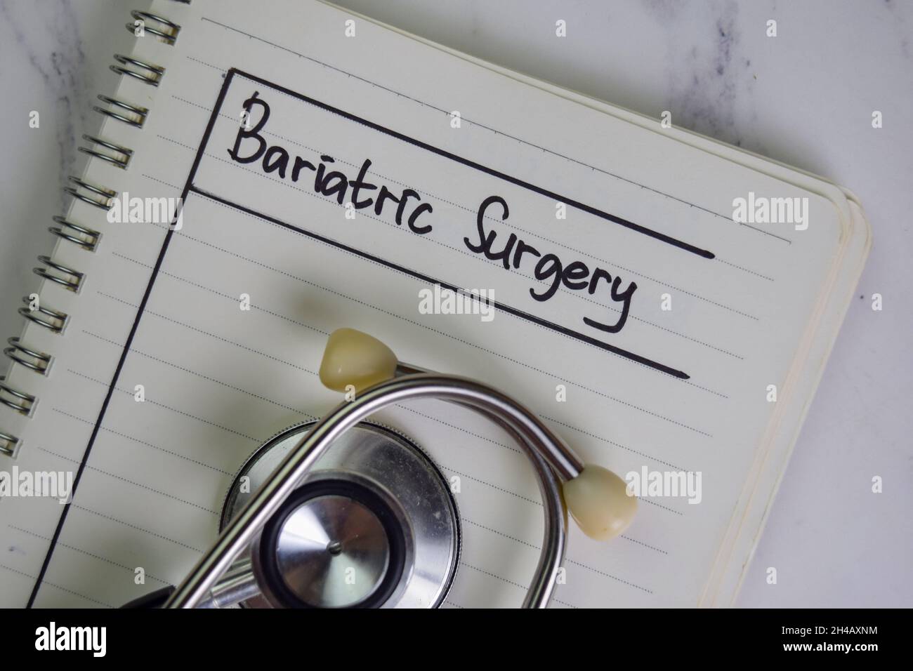 Bariatric Surgery write on a book isolated on Wooden Table Stock Photo ...