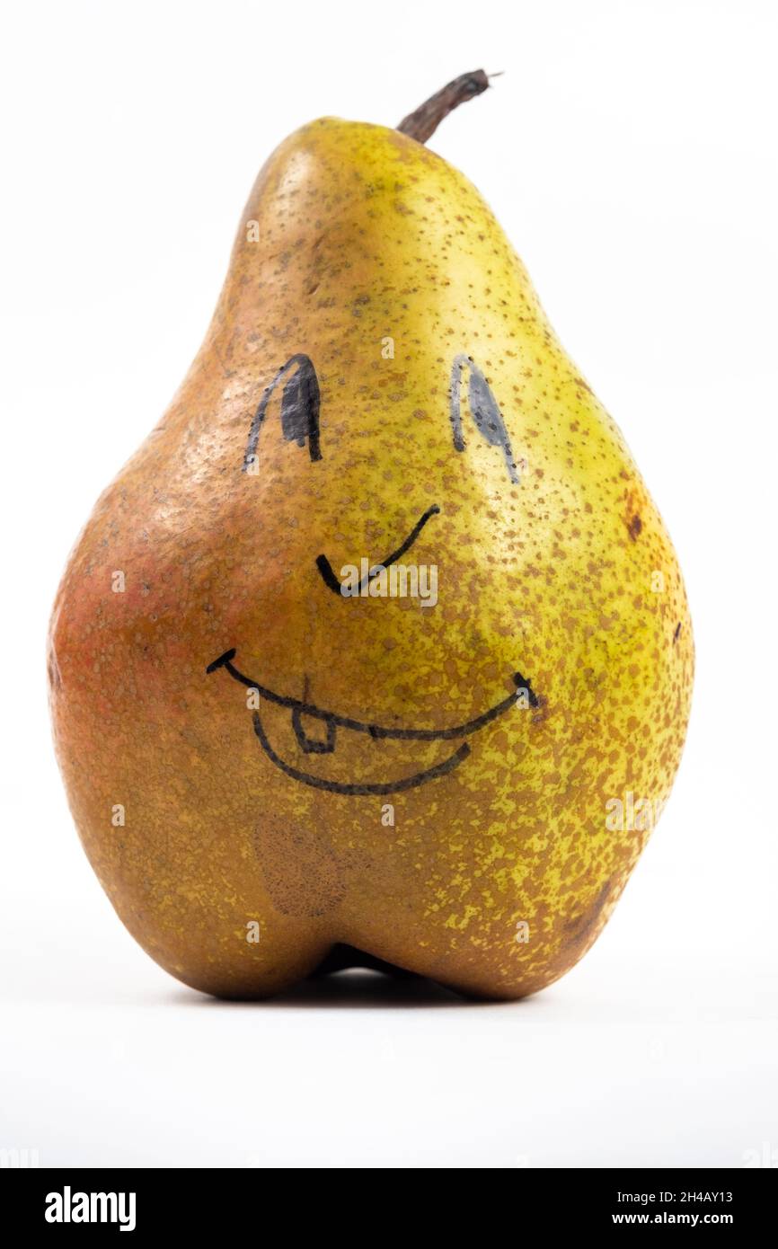 A large pear with a painted smiley face on a white isolated background ...