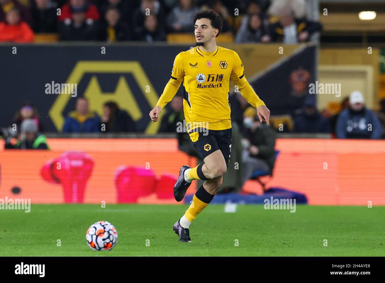Rayan Ait-Nouri #3 of Wolverhampton Wanderers looks for player to pass ...