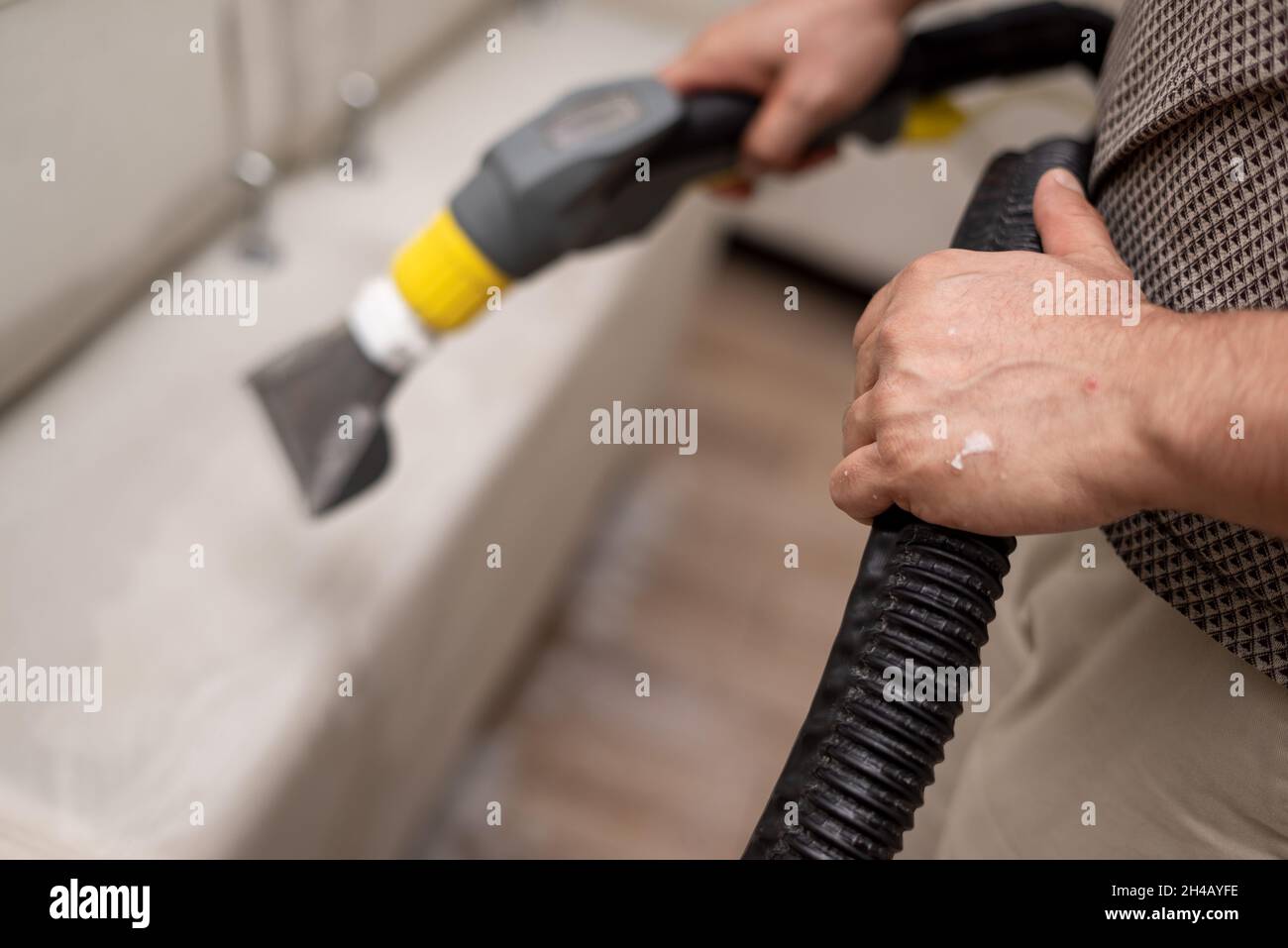 Cleaning a dirty sofa with a sofa washer Stock Photo - Alamy