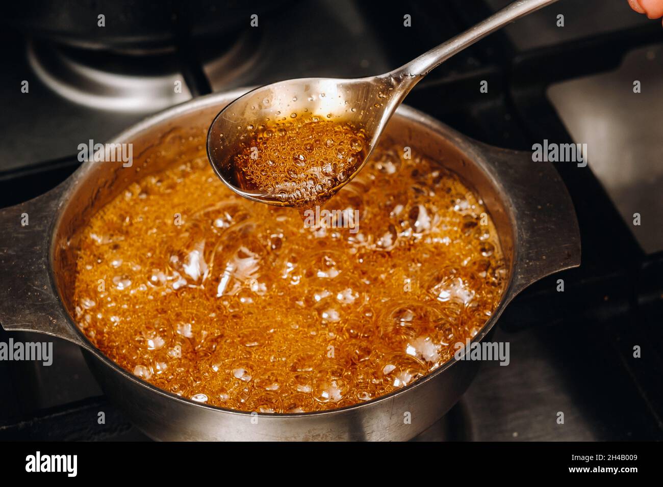 Preparation of sugar candies at home.A taste of our childhood.Rooster ...