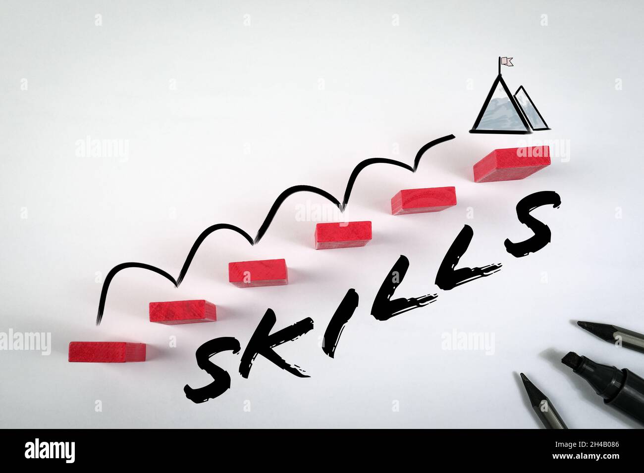 Skills Concept. Red blocks and stationery on a white background Stock ...
