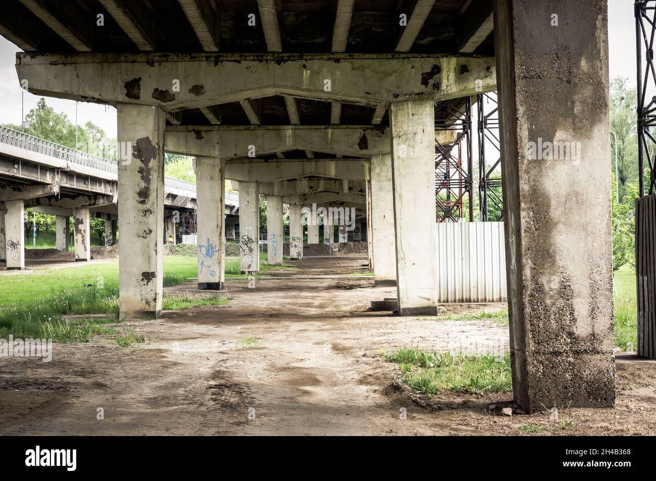 Old weathered stone columns under a bridge Stock Photo - Alamy