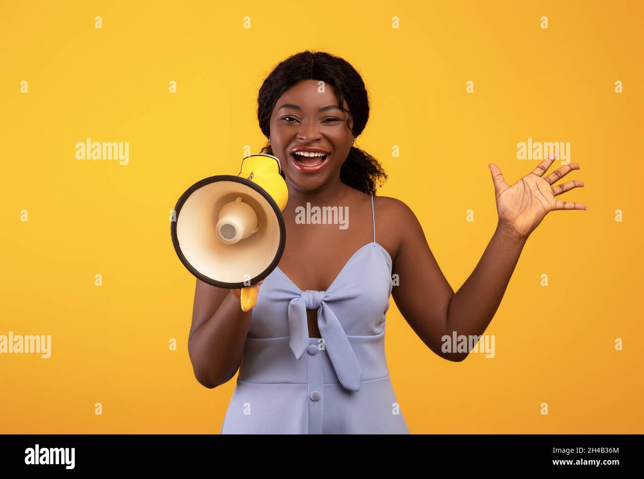 Great shopping offer. Millennial black woman yelling into megaphone ...