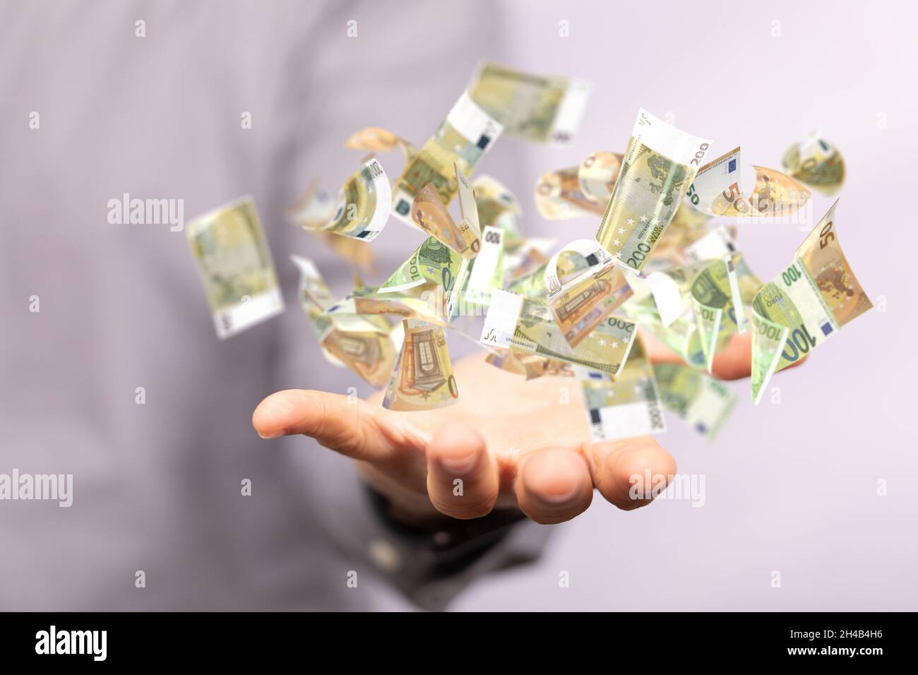 Man hand on blurred background holding cashflow euro banknote bill in ...