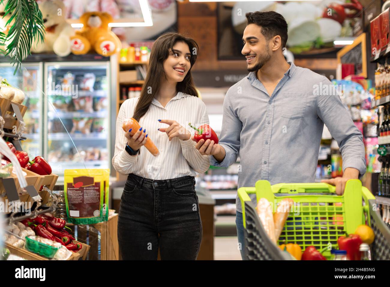Happy Middle Eastern Spouses Choosing Vegetables During Grocery ...
