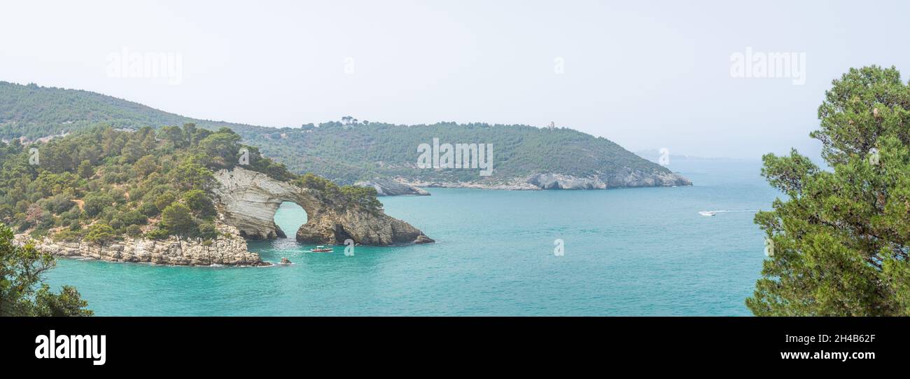 Panorama seascape of Apulian coastline with natural arch formation and ...