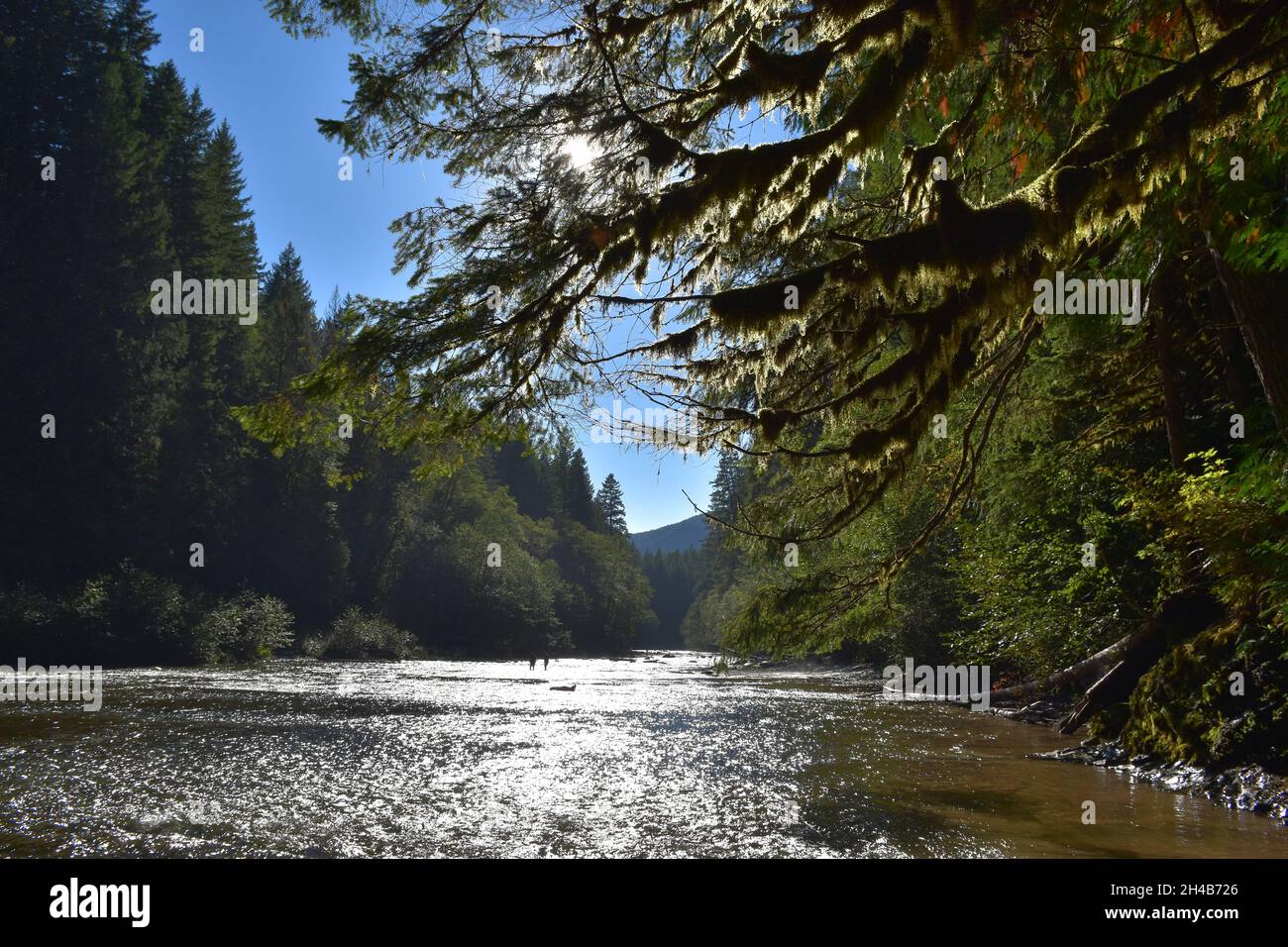 Two people enjoy an idyllic late summer day on the shallow Lower Lewis ...